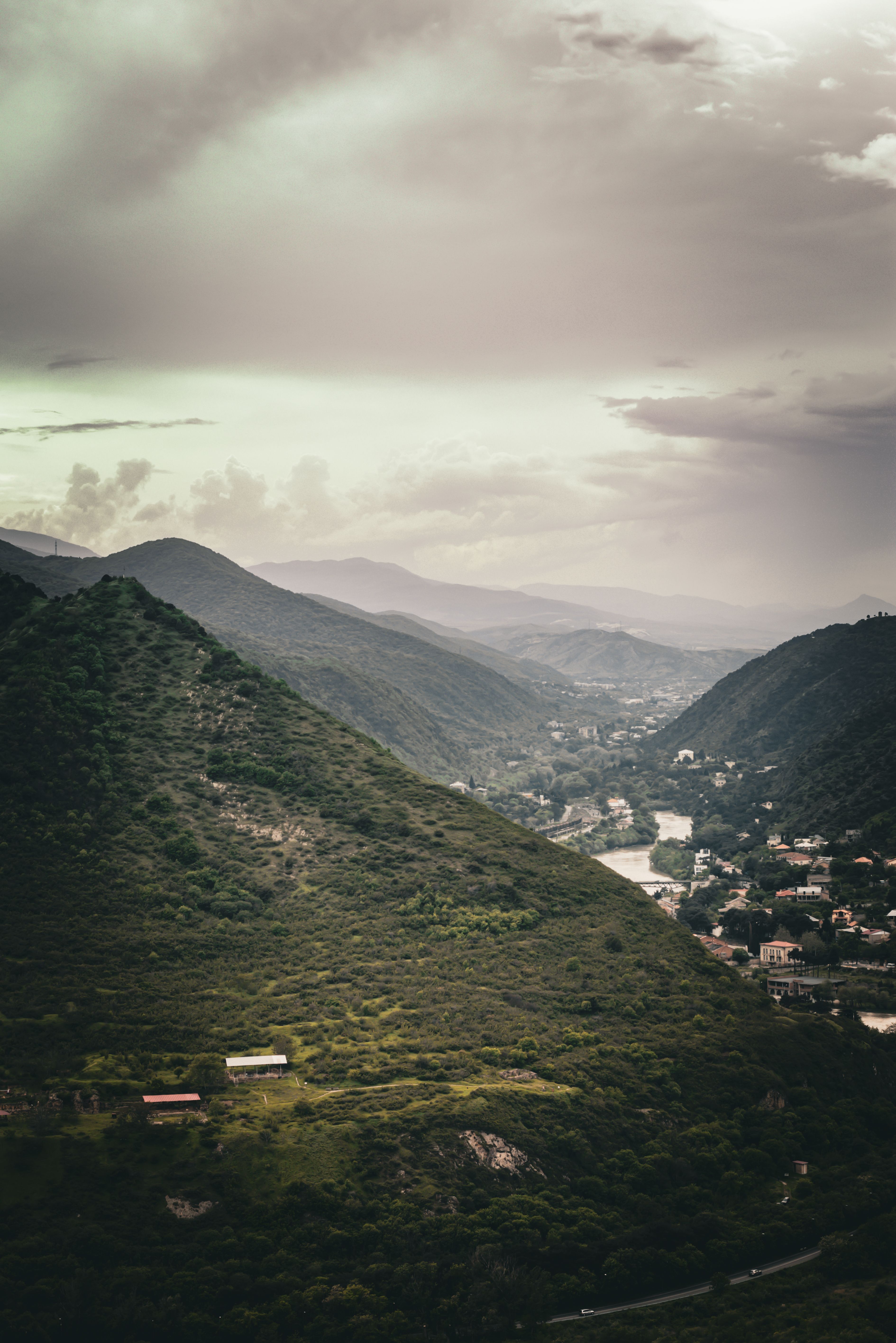Castle in Green Valley near Rock Mountains · Free Stock Photo