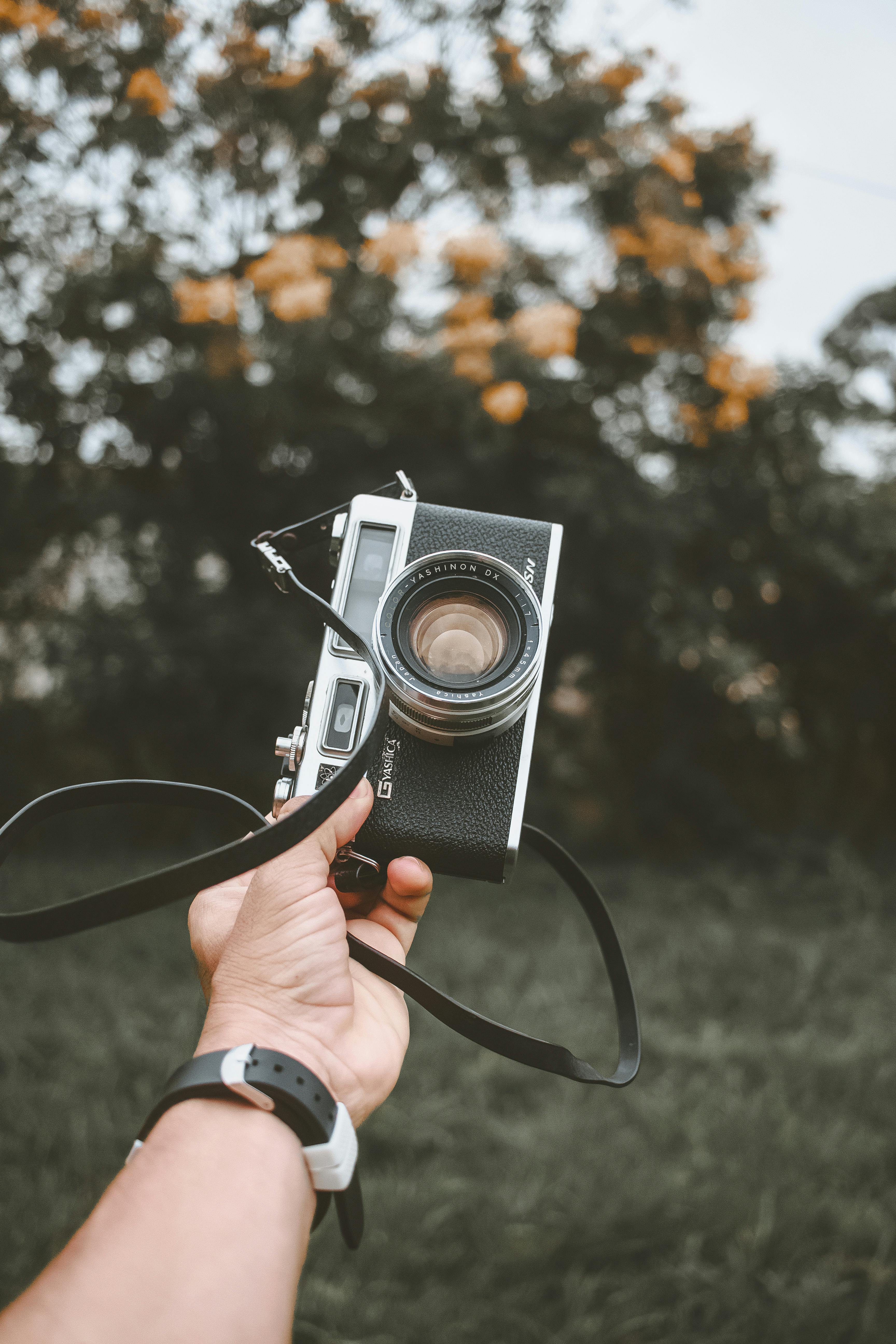 Man Holding a Film Camera · Free Stock Photo
