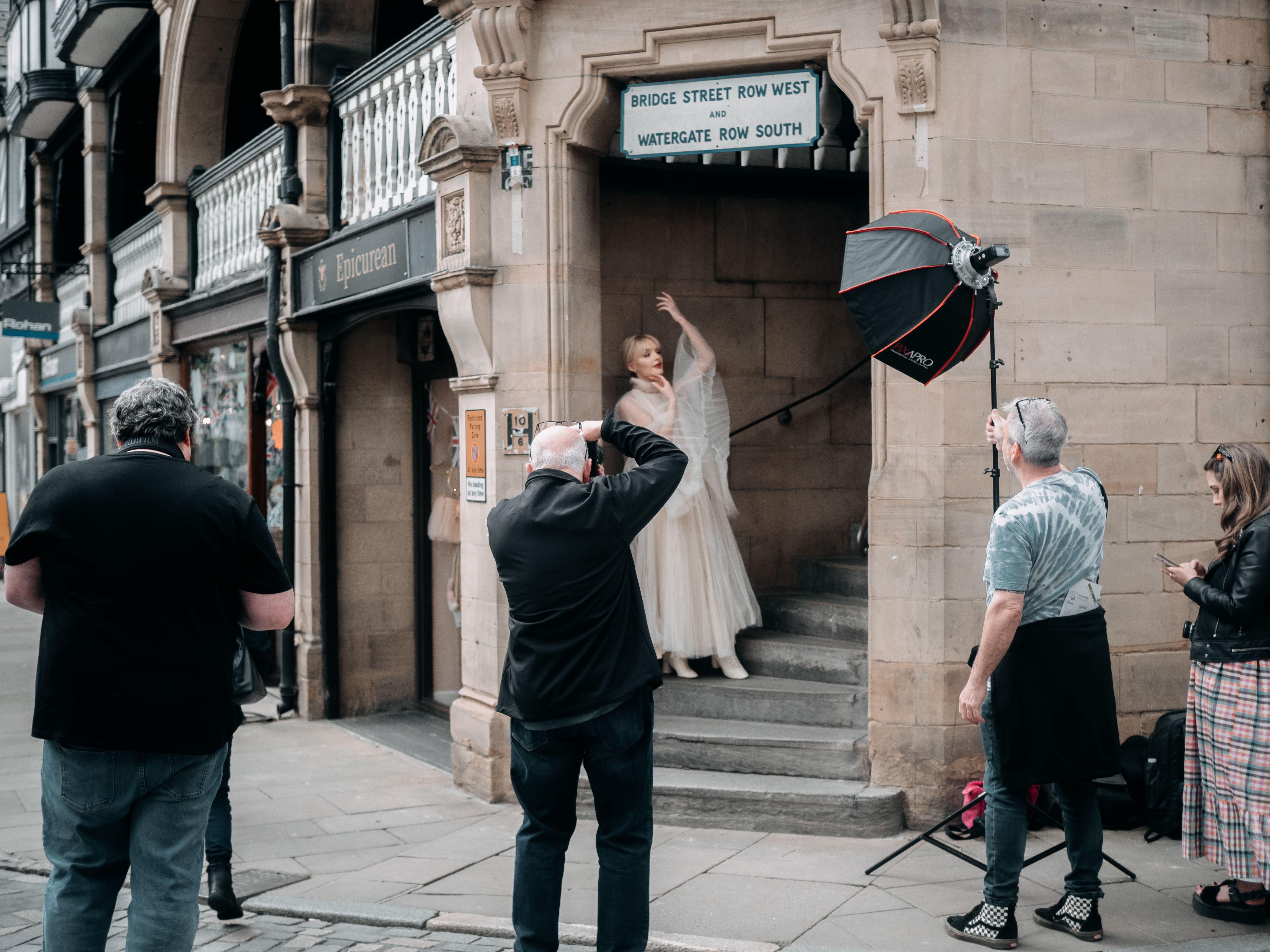 Team of Photographers Filming Woman near Old Building · Free Stock Photo