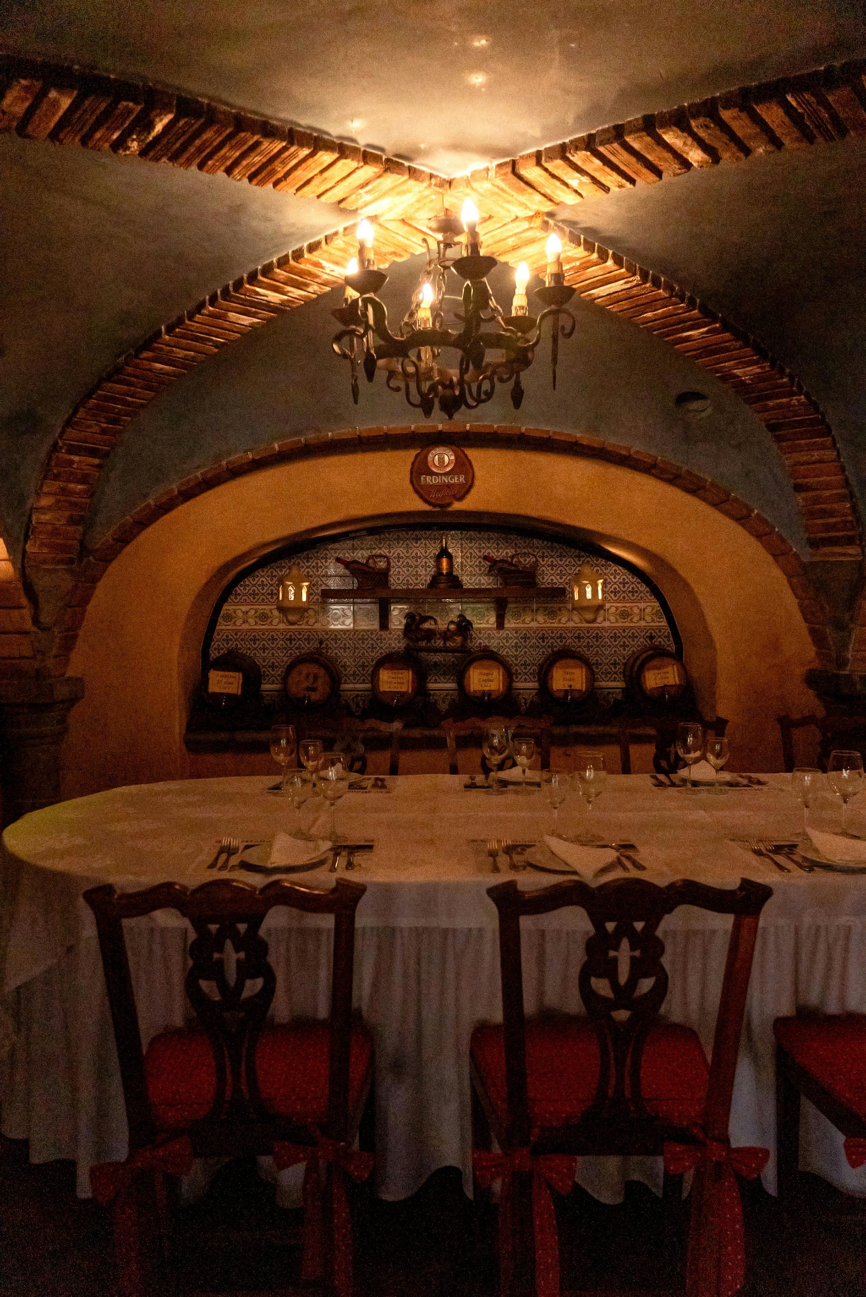 Dark Restaurant Interior with a Chandelier over a Set Table · Free ...