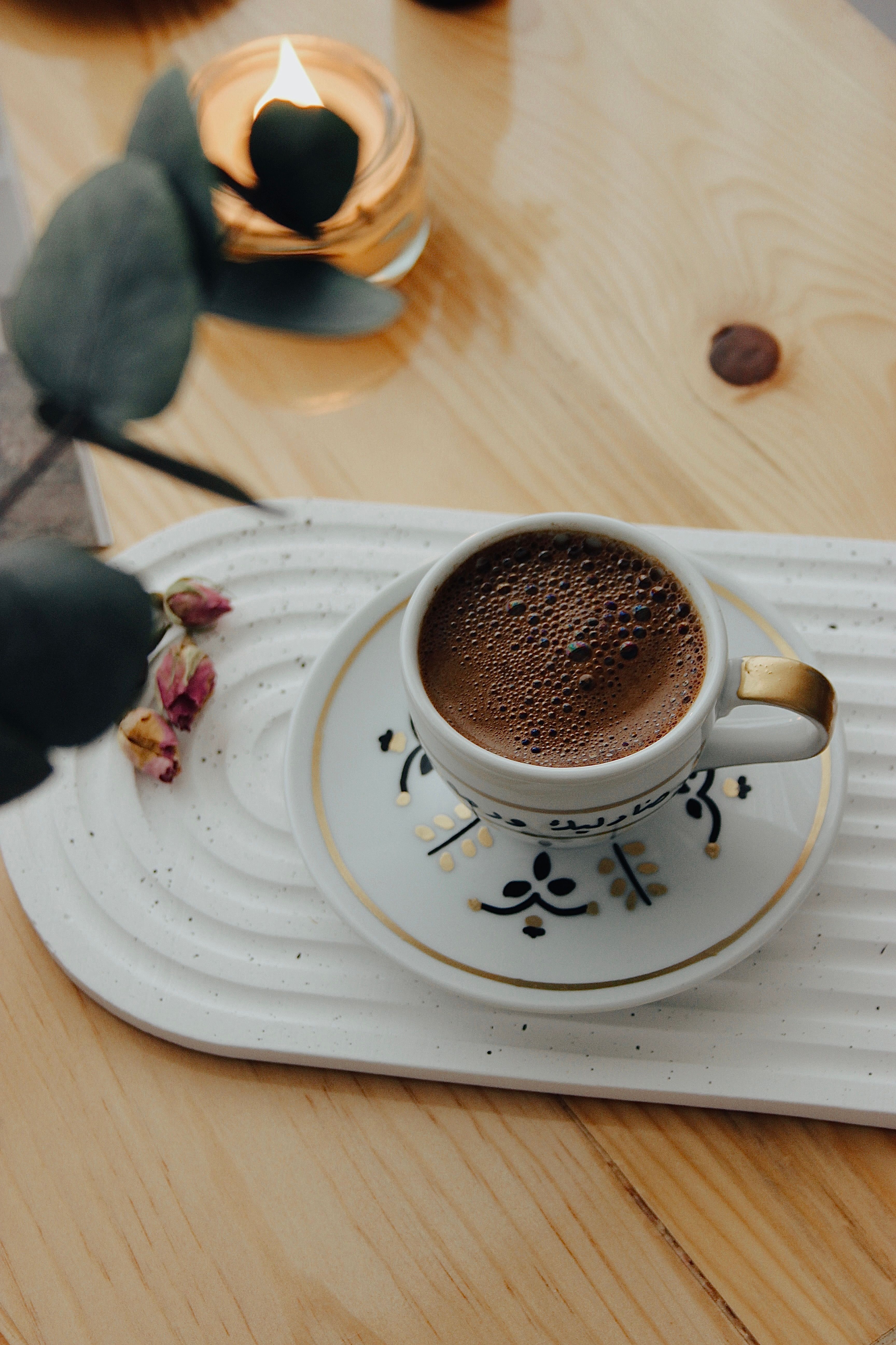 Cup of Coffee on Plate with Leaves · Free Stock Photo