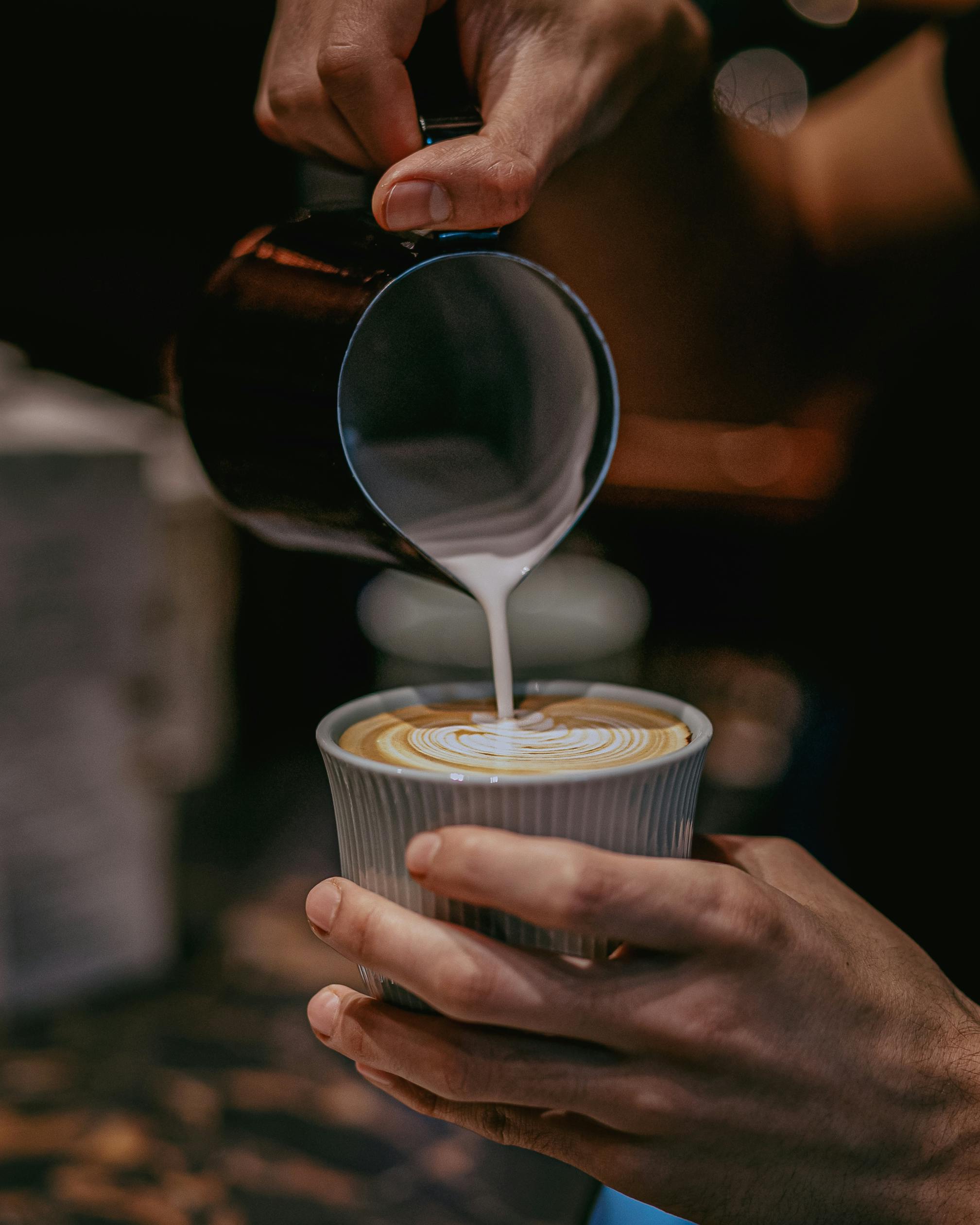 Barista Decorating Coffee with Milk · Free Stock Photo