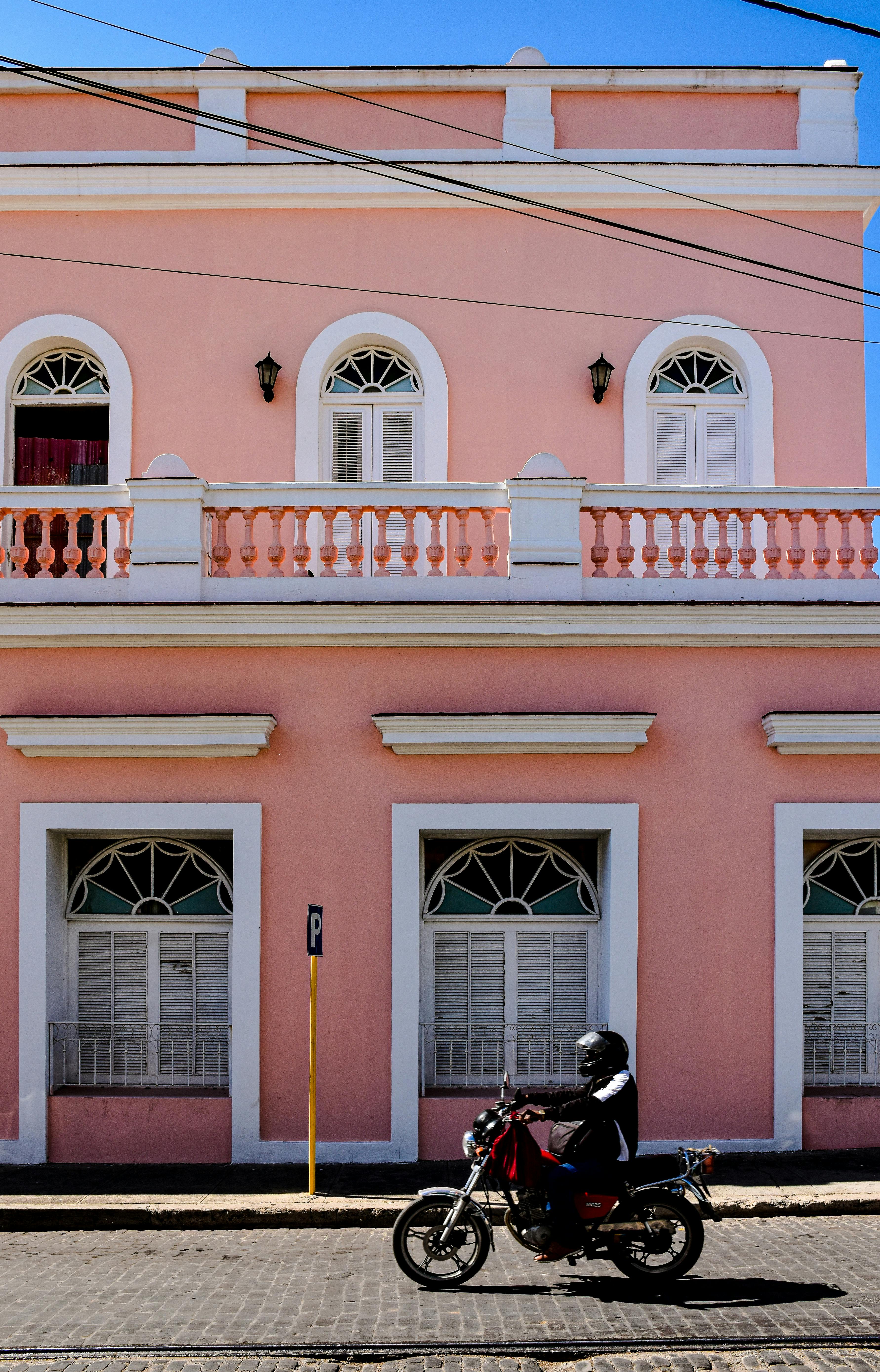 Multi Colored Concrete Buildings Under Blue Sky · Free Stock Photo