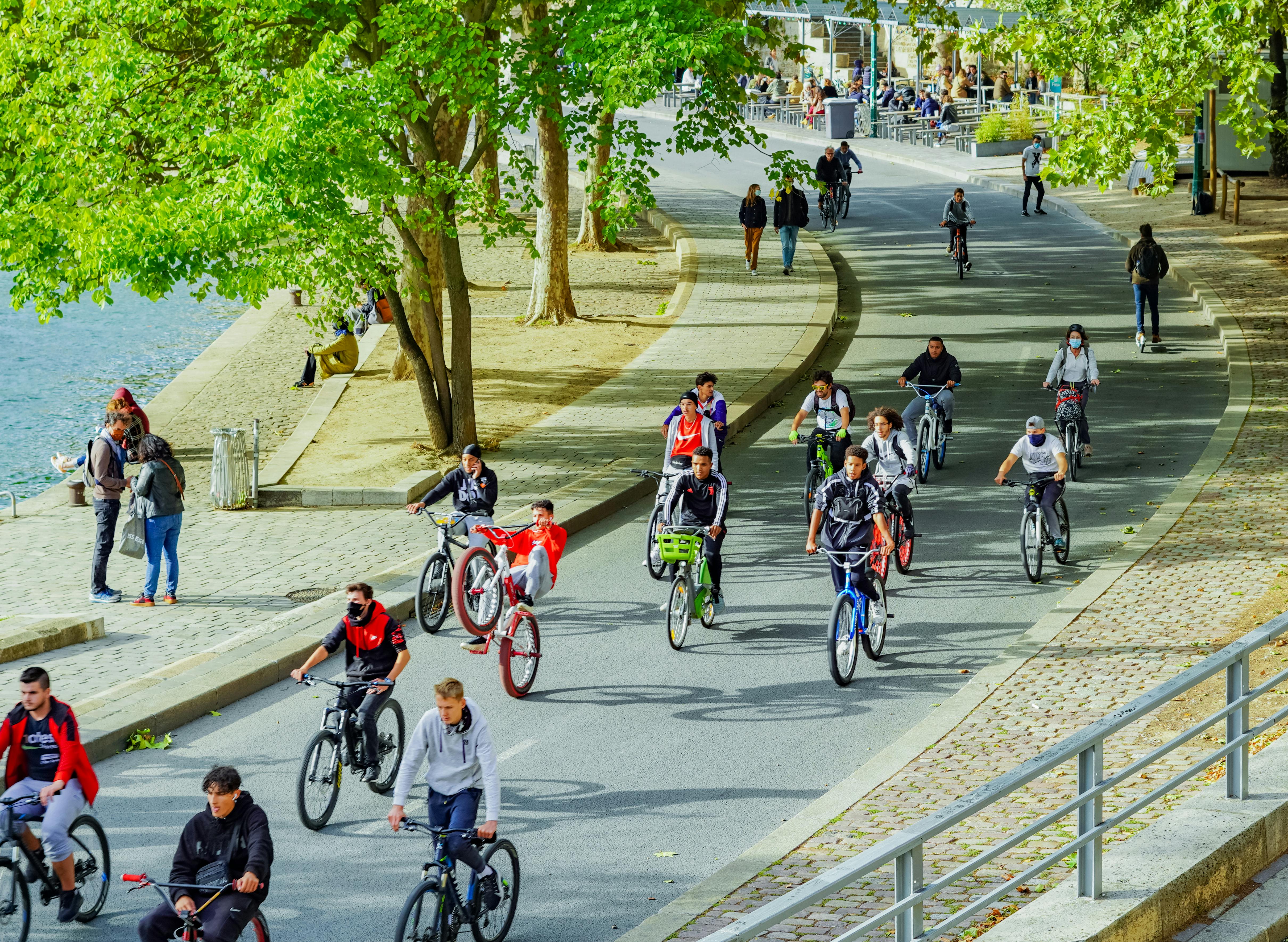 A Group of Cyclists on a Road · Free Stock Photo