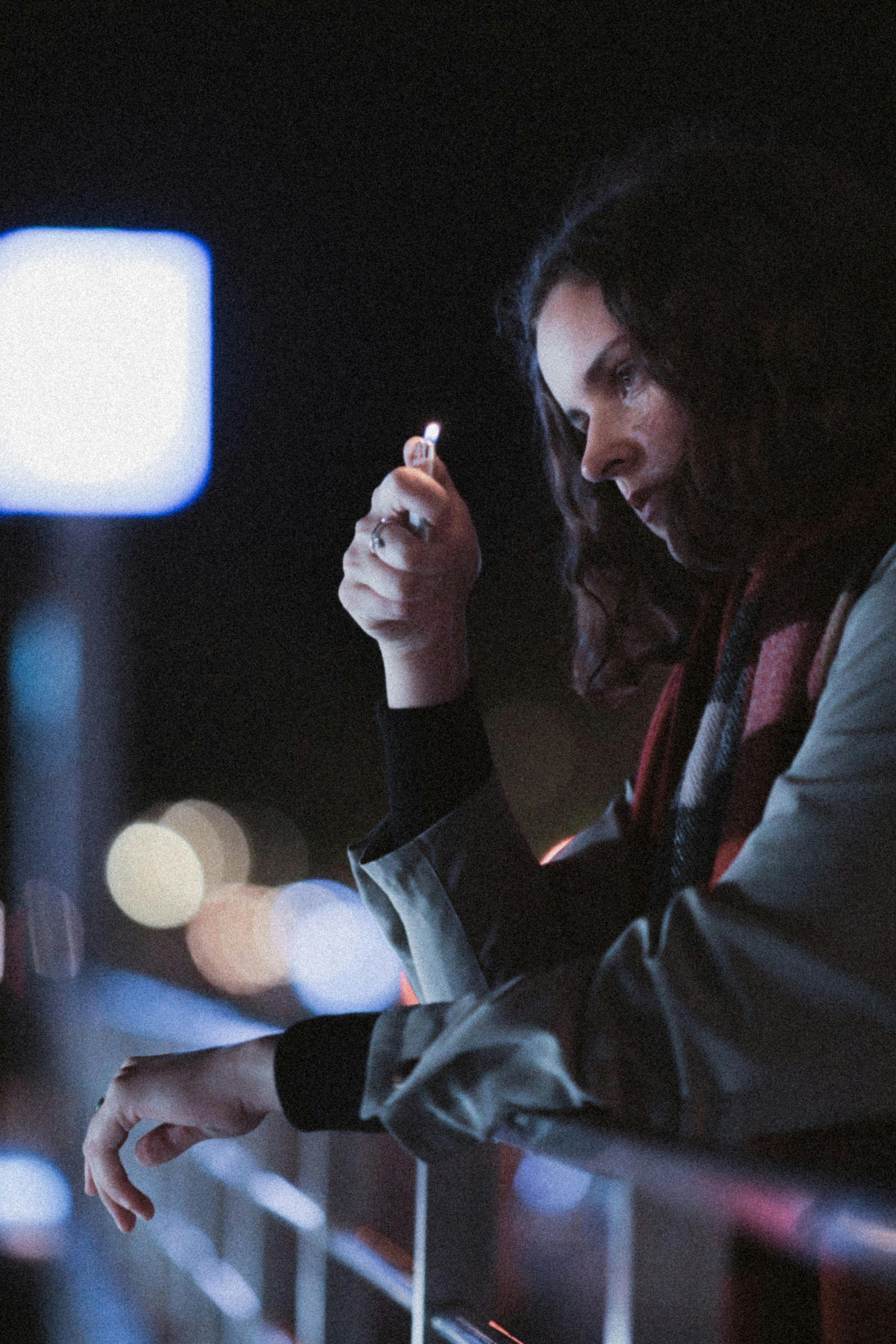 A Young Woman with a Lighter on a Concert · Free Stock Photo