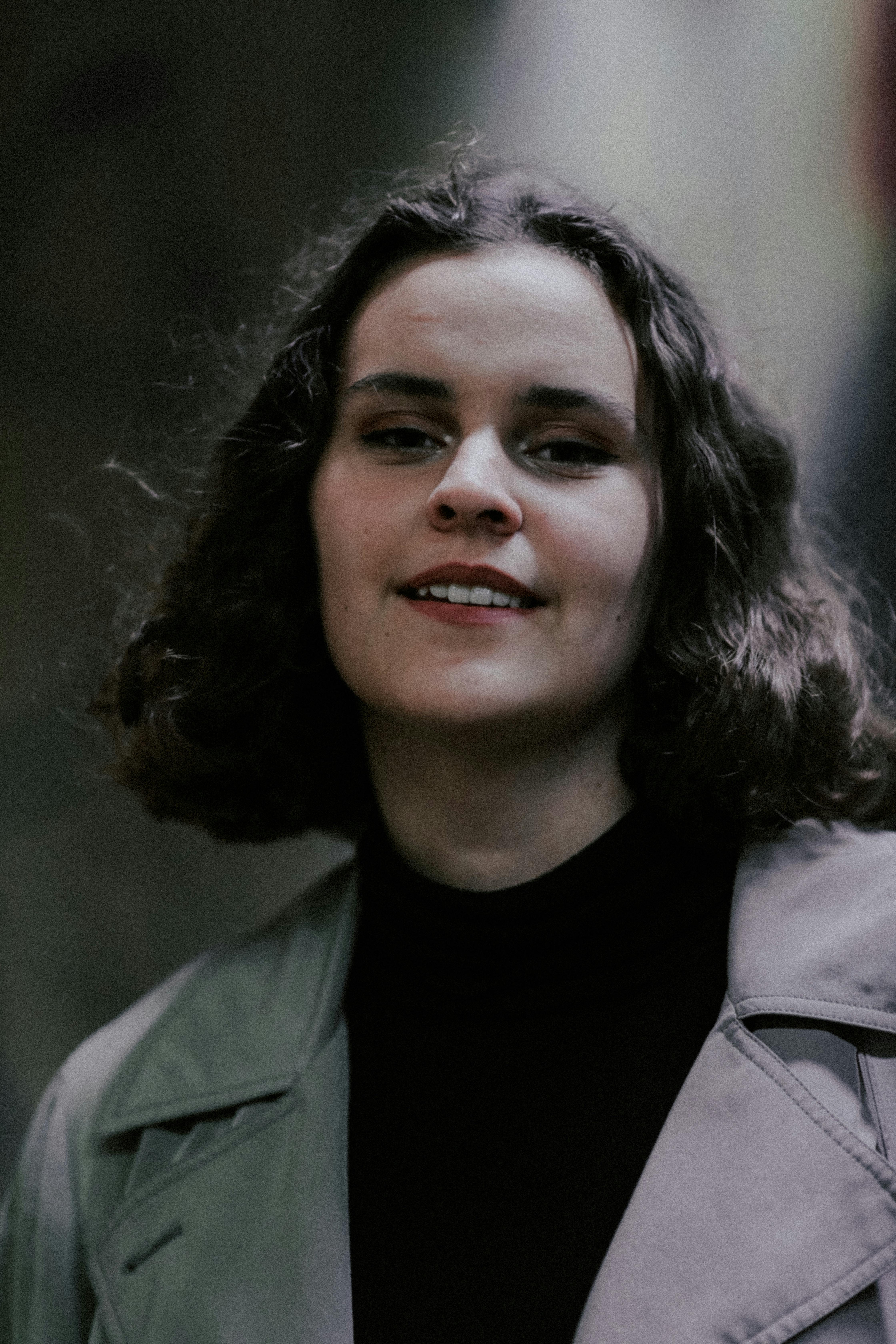 Woman in Blue Jacket Smiling · Free Stock Photo