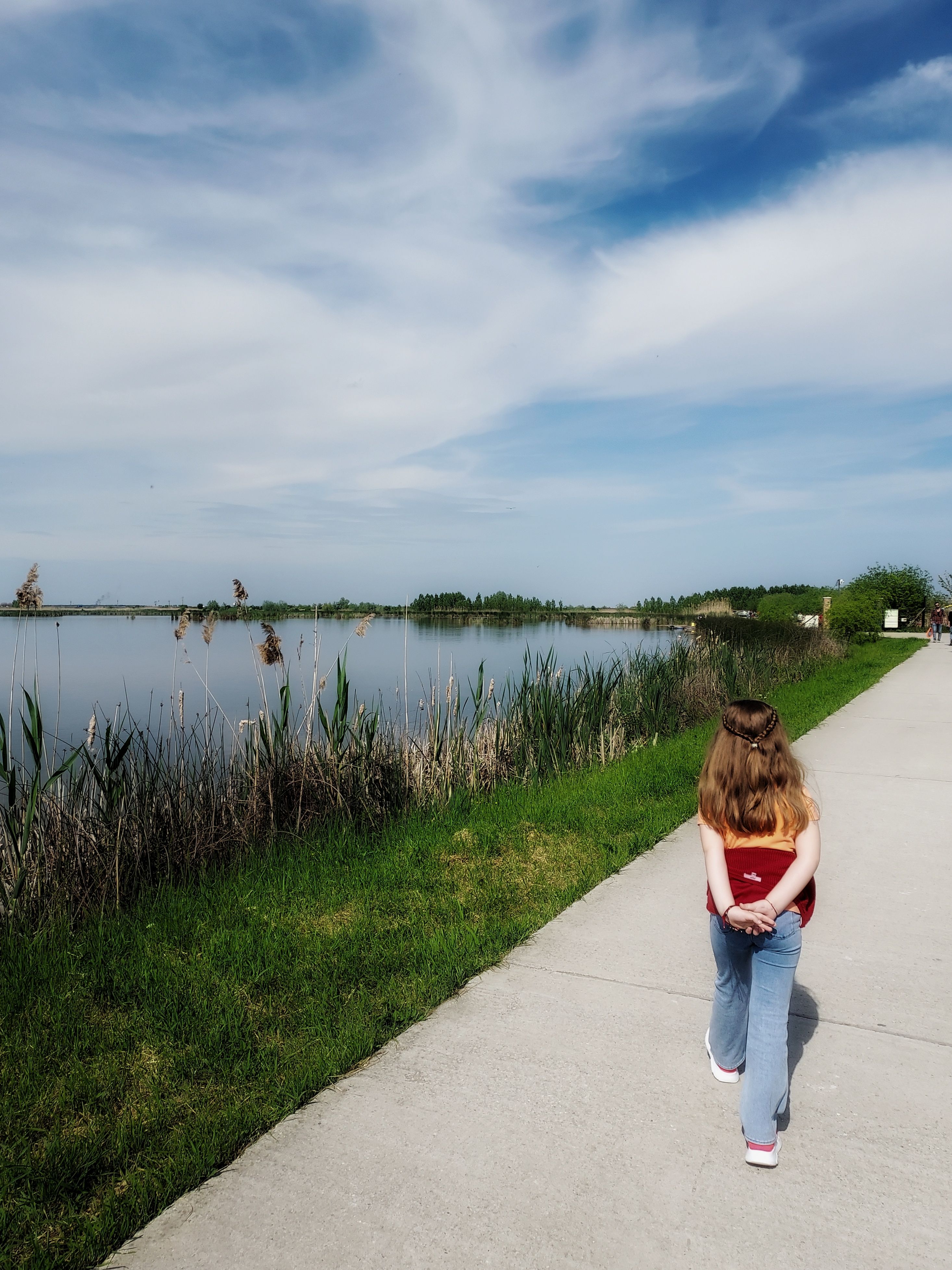 Girl Walking by the Lake · Free Stock Photo