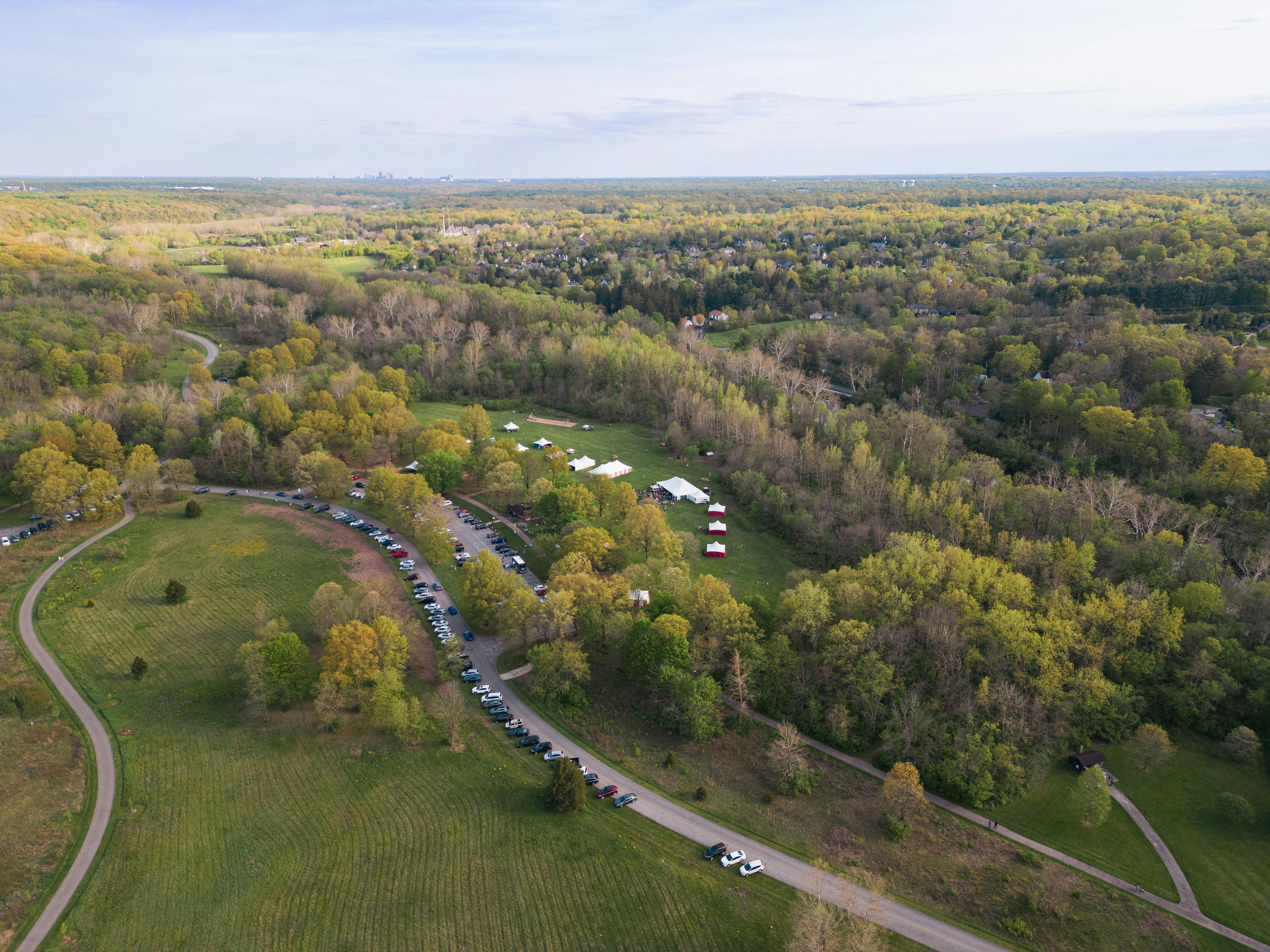 Birds Eye View of Tents on Green Grass Field · Free Stock Photo