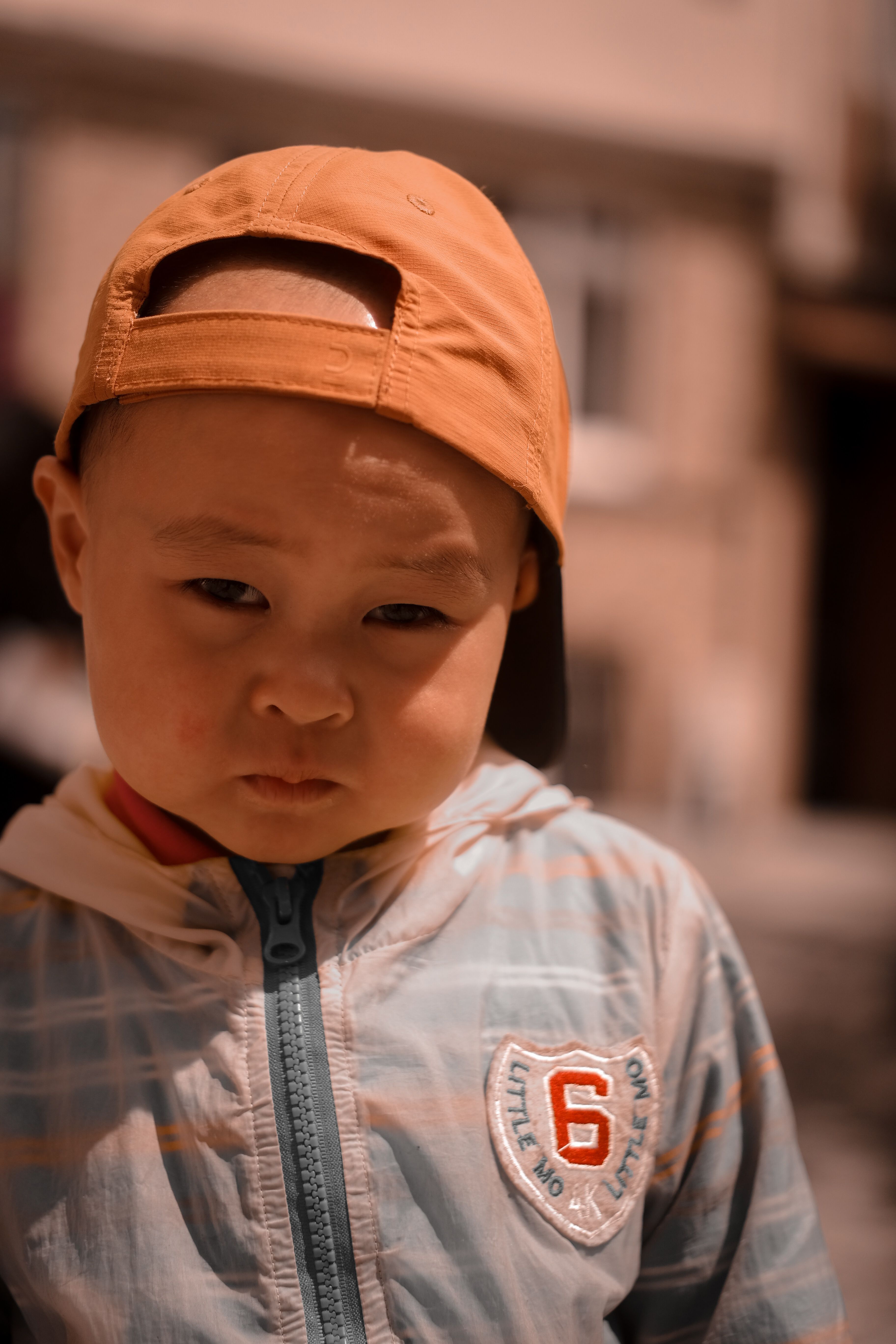 A Portrait of a Boy Wearing Cap · Free Stock Photo