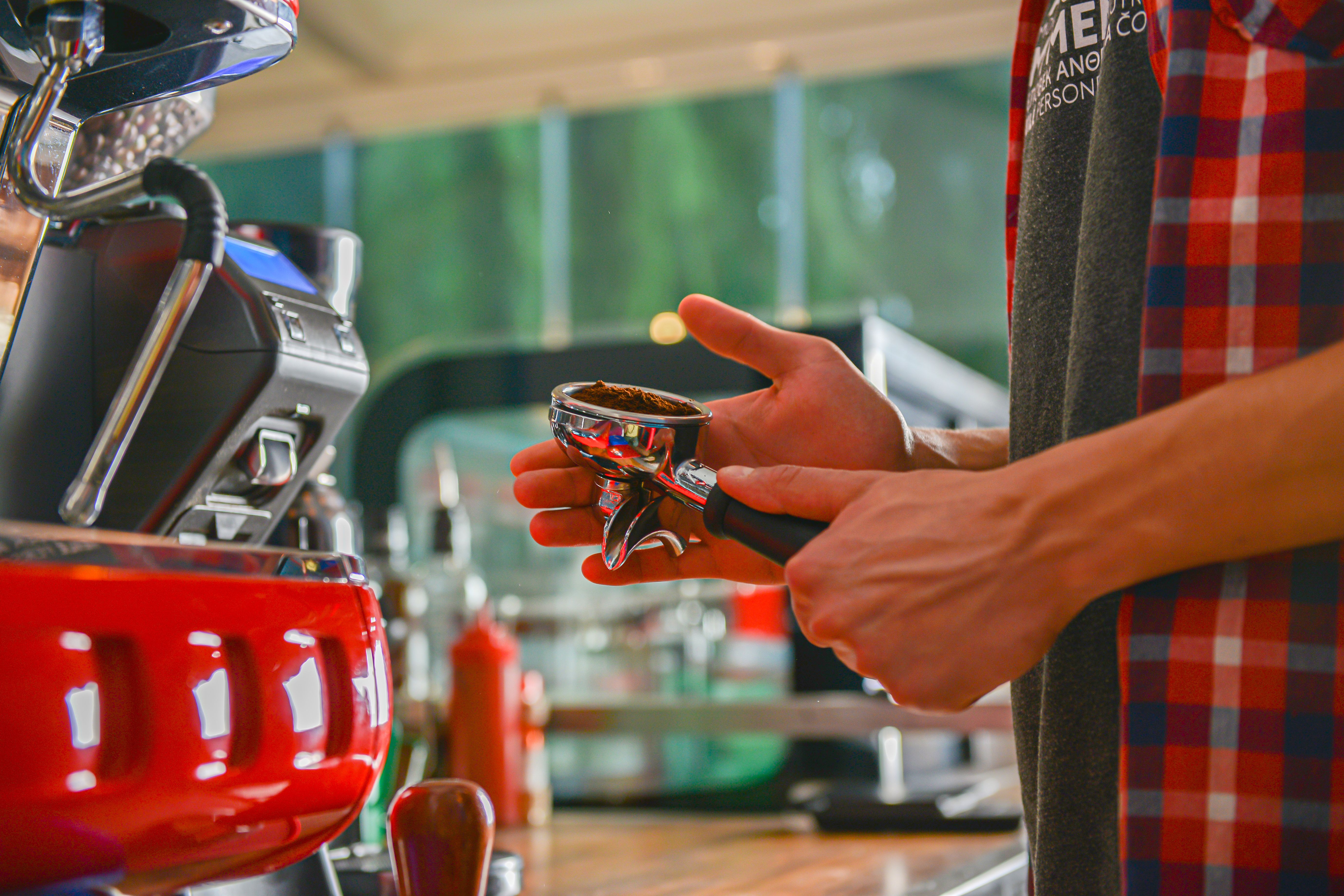 Close-up of a Barista Preparing Coffee · Free Stock Photo