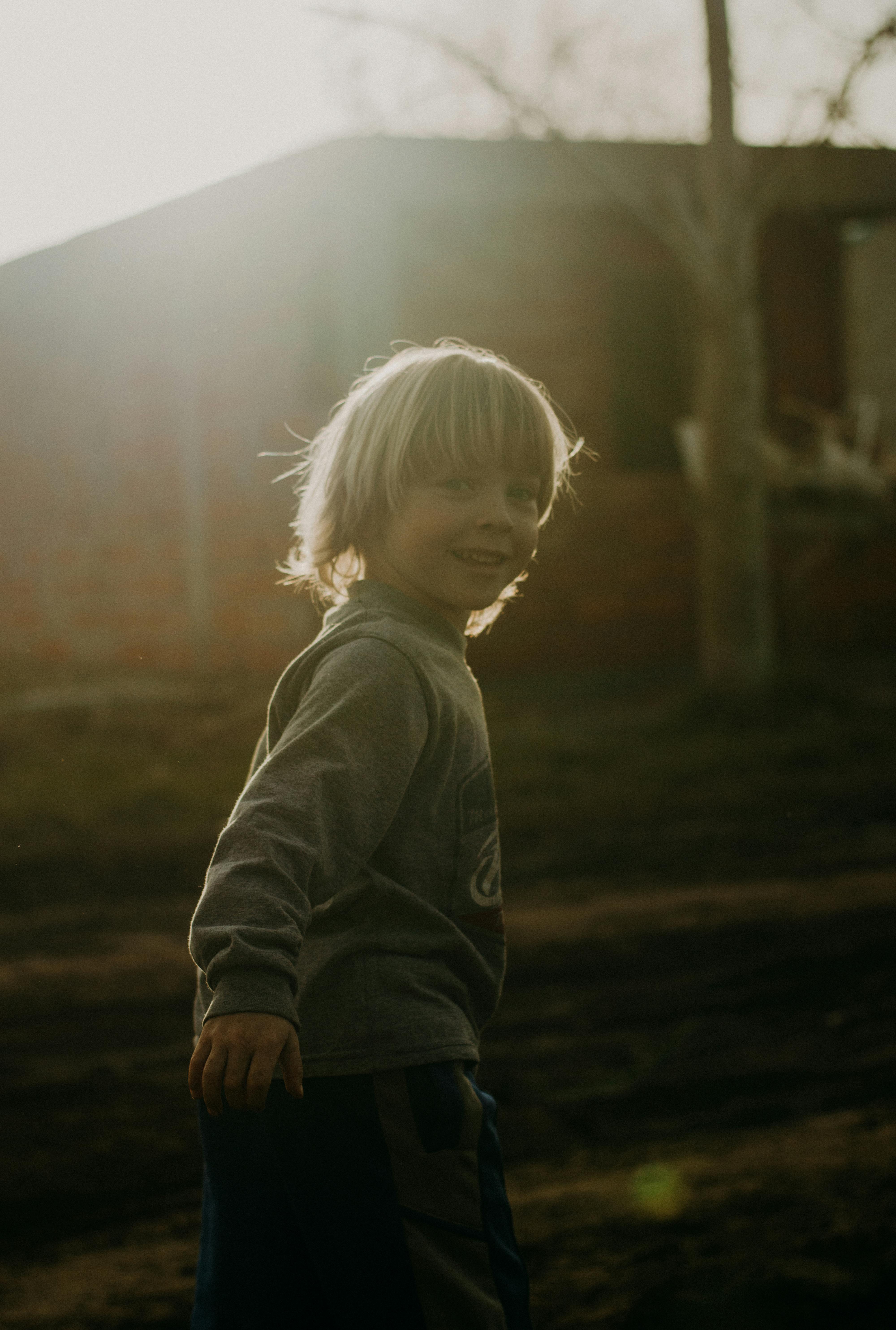 Running Boy Looking over his Shoulder · Free Stock Photo