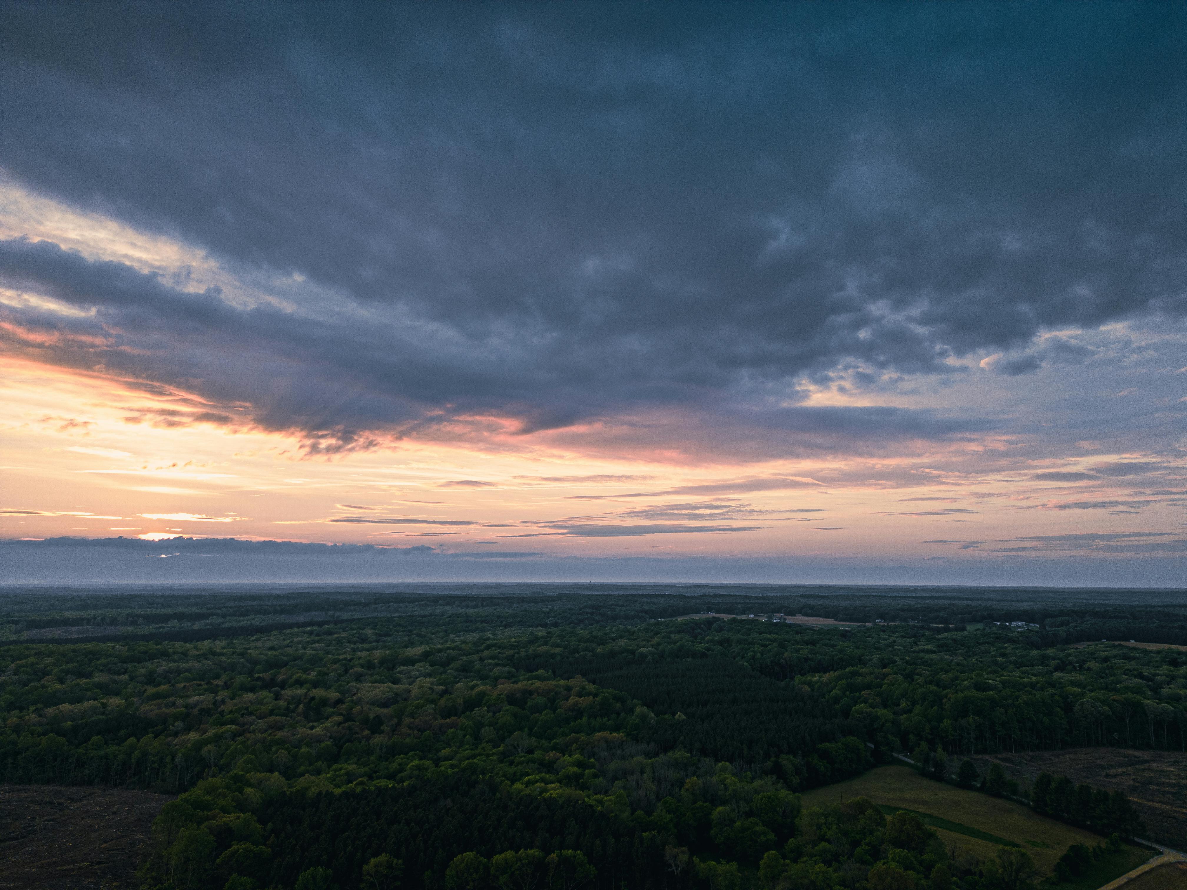 Sunset over Forests and Fields · Free Stock Photo
