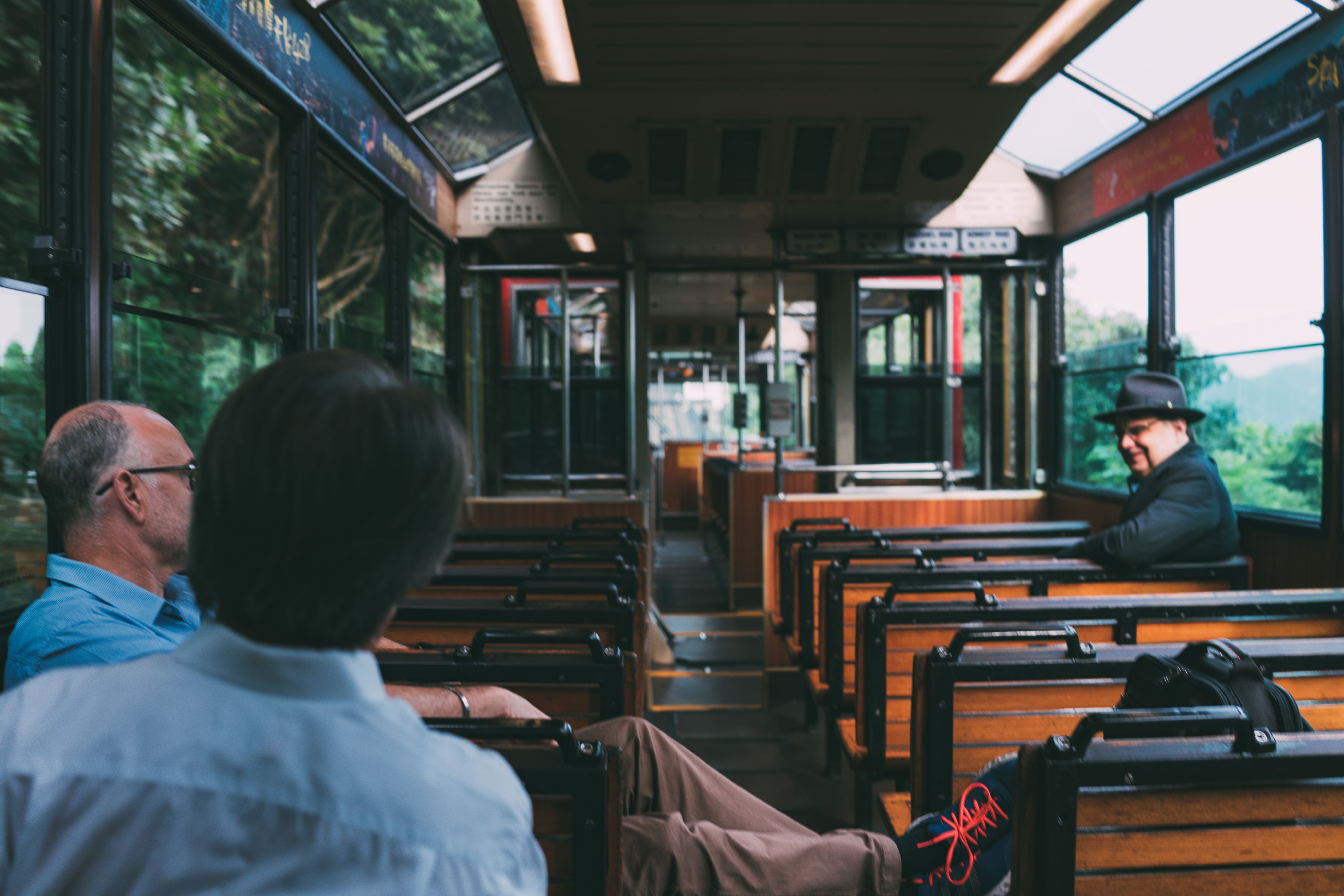 Group of Men Sitting in a Train with Large Windows · Free Stock Photo