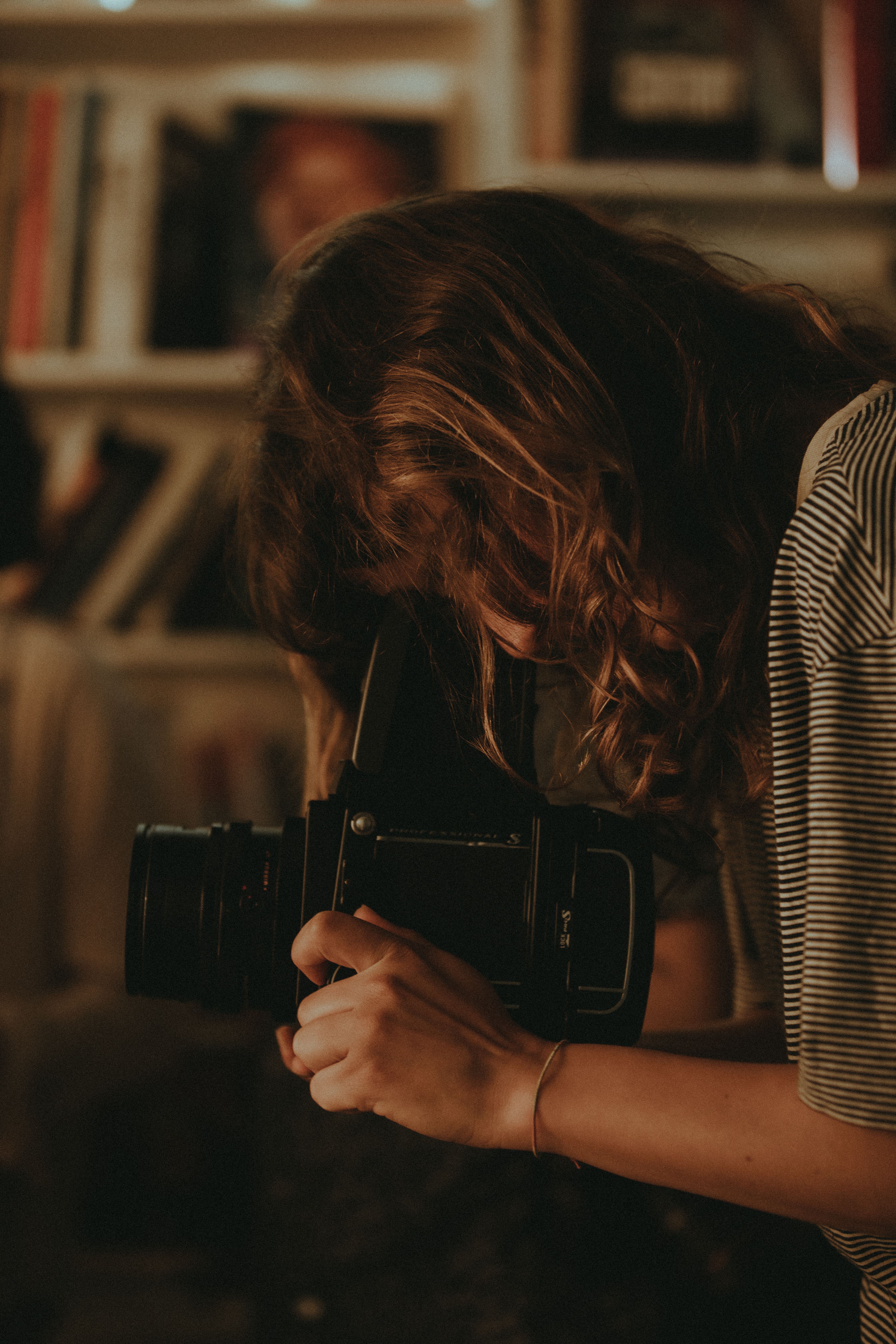 Woman Looking into Vintage Analog Photo Camera Viewfinder · Free Stock ...