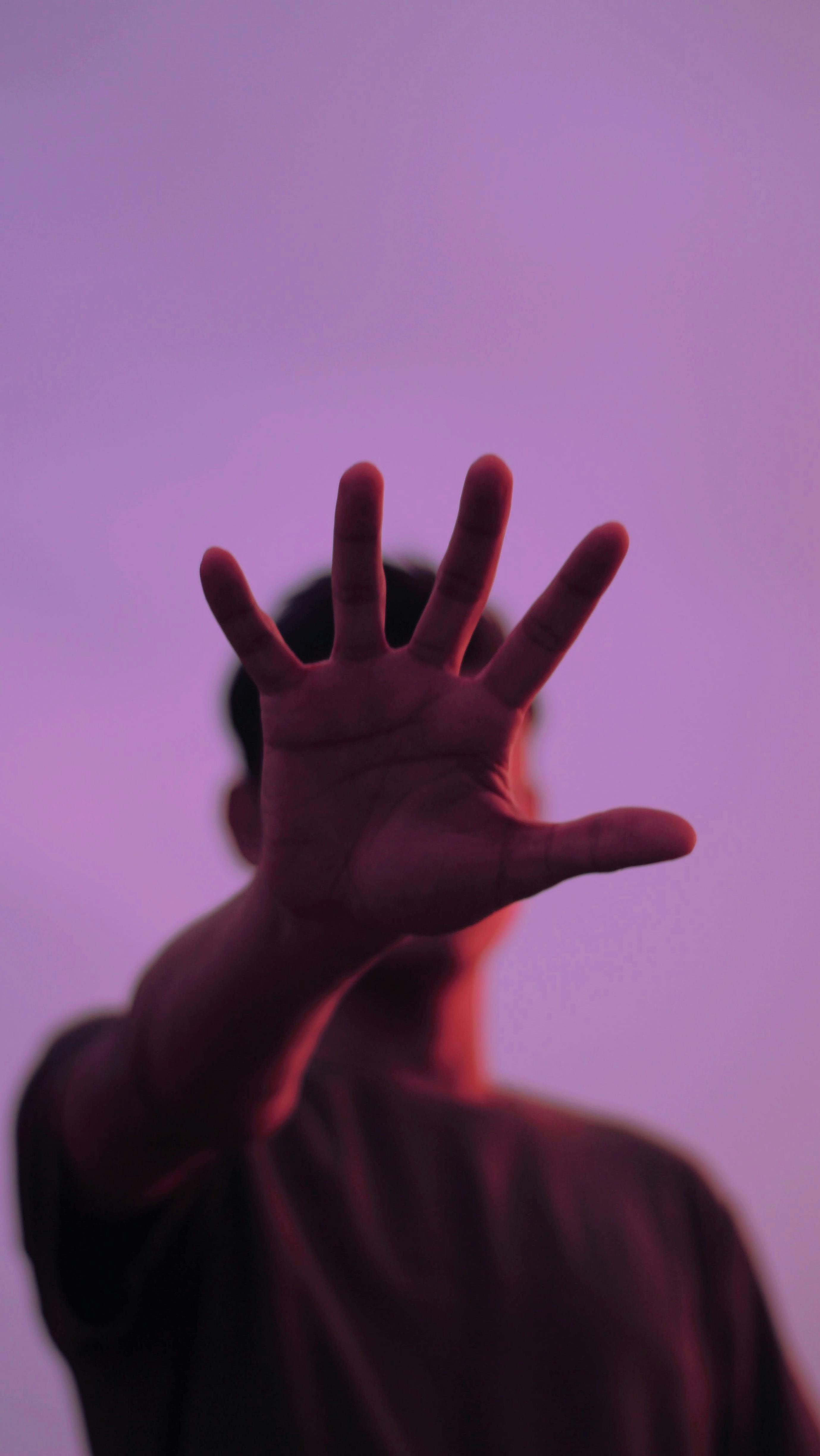 A Man Blocking His Face with His Hand · Free Stock Photo