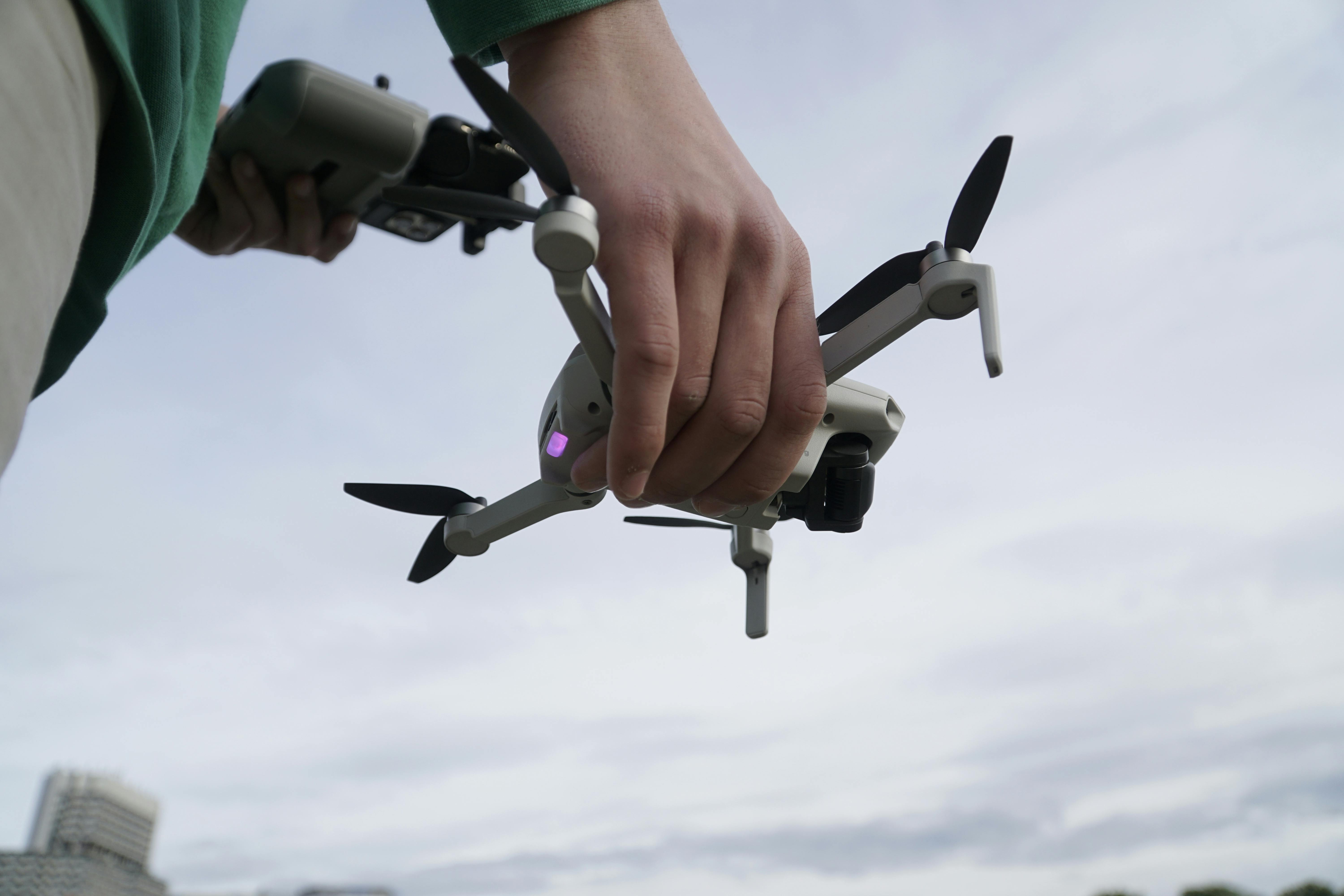 Person Launching a Quadcopter Drone · Free Stock Photo