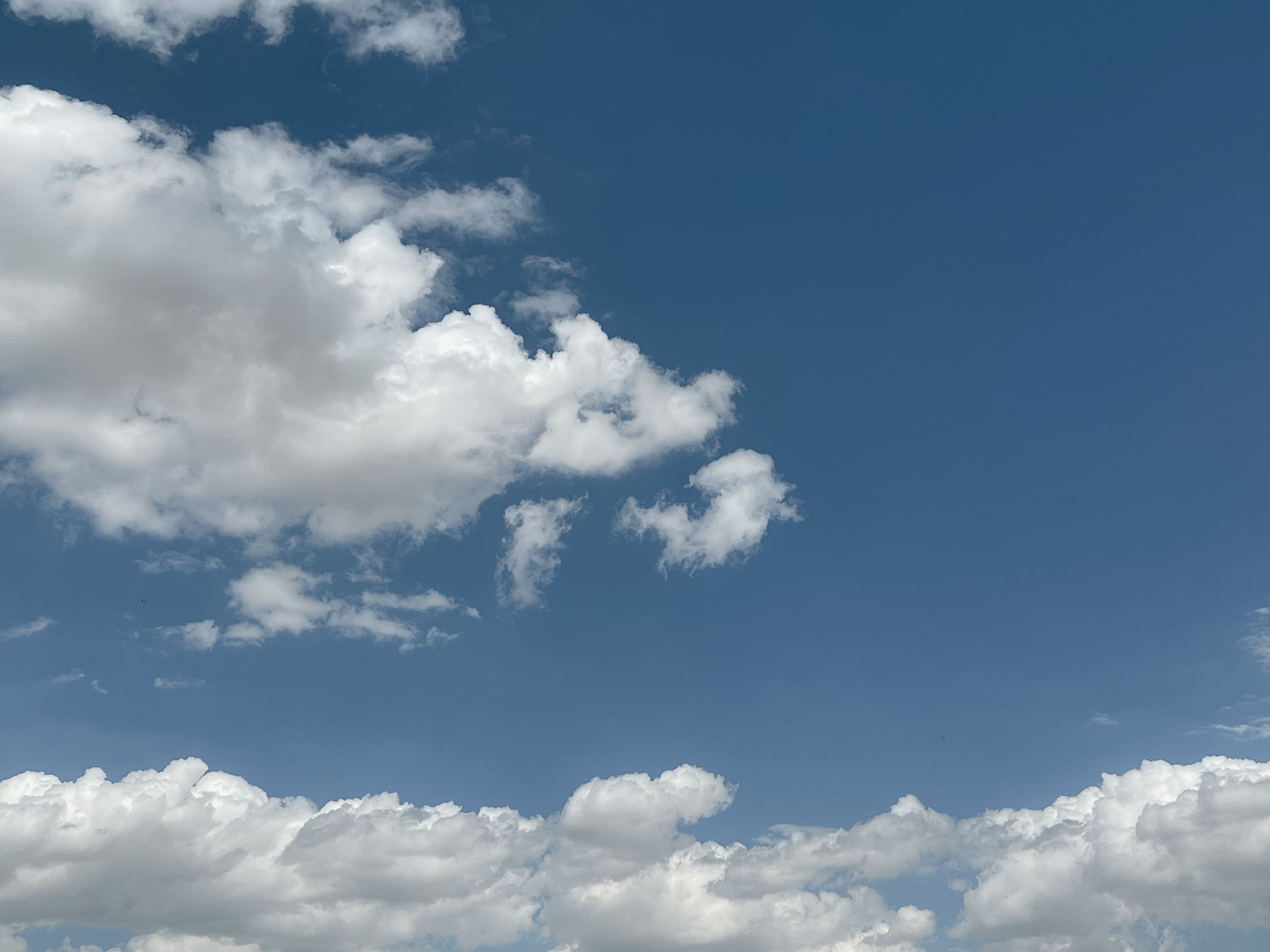 Fluffy White Clouds in Blue Sky · Free Stock Photo