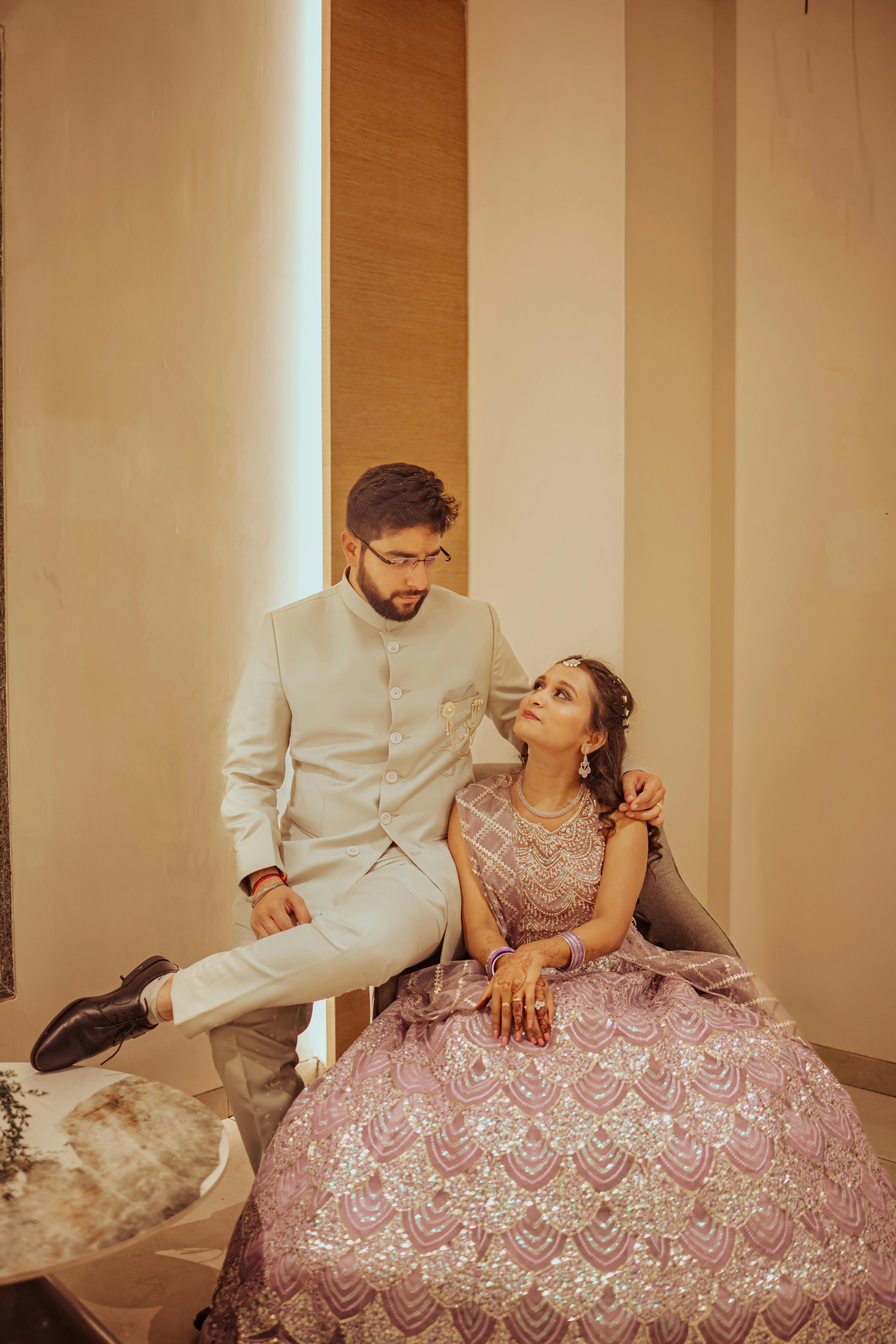 Photo of a Standing Wedding Couple Wearing Traditional Wedding Dress ...