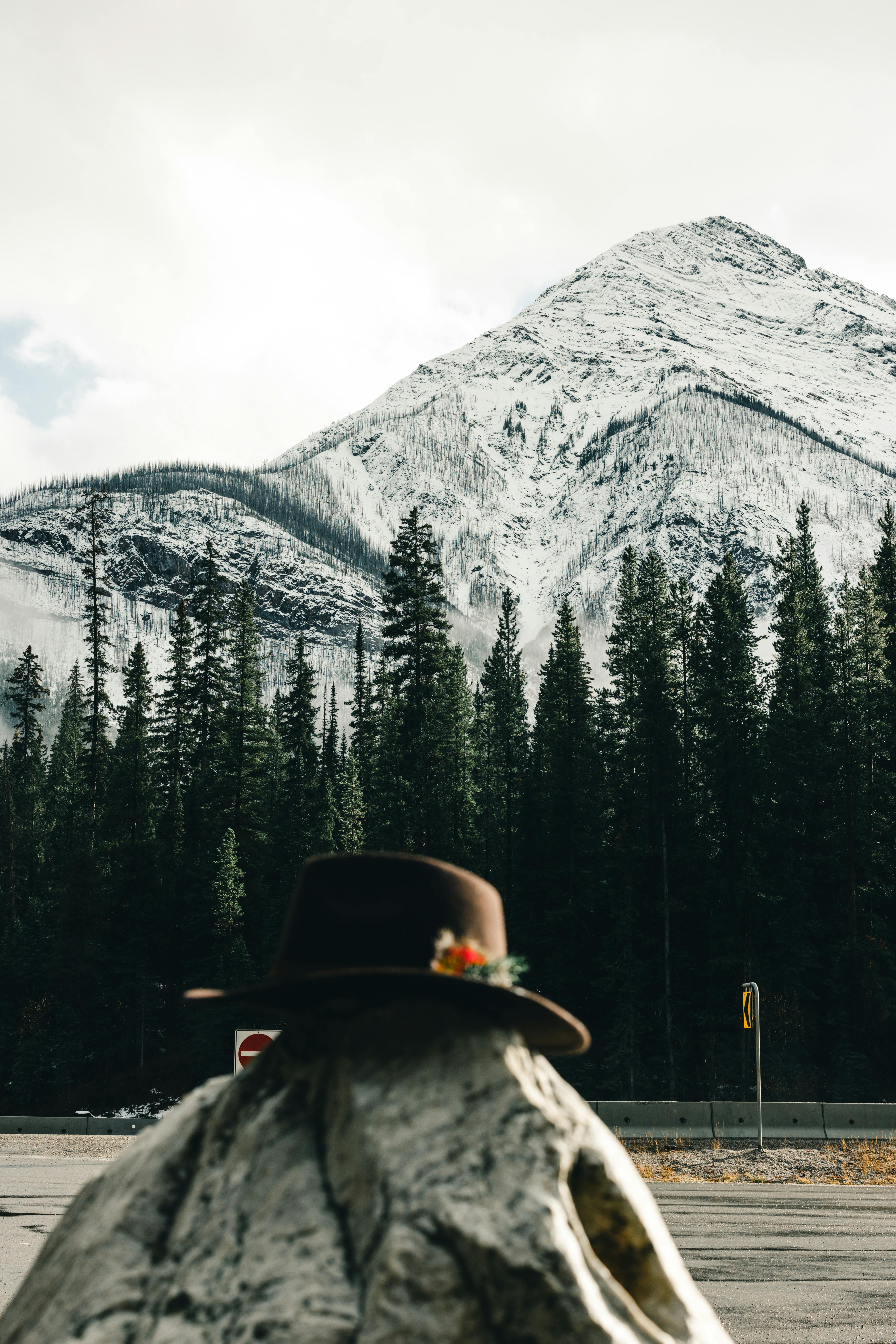 Hat on Rock with Moutnain behind · Free Stock Photo