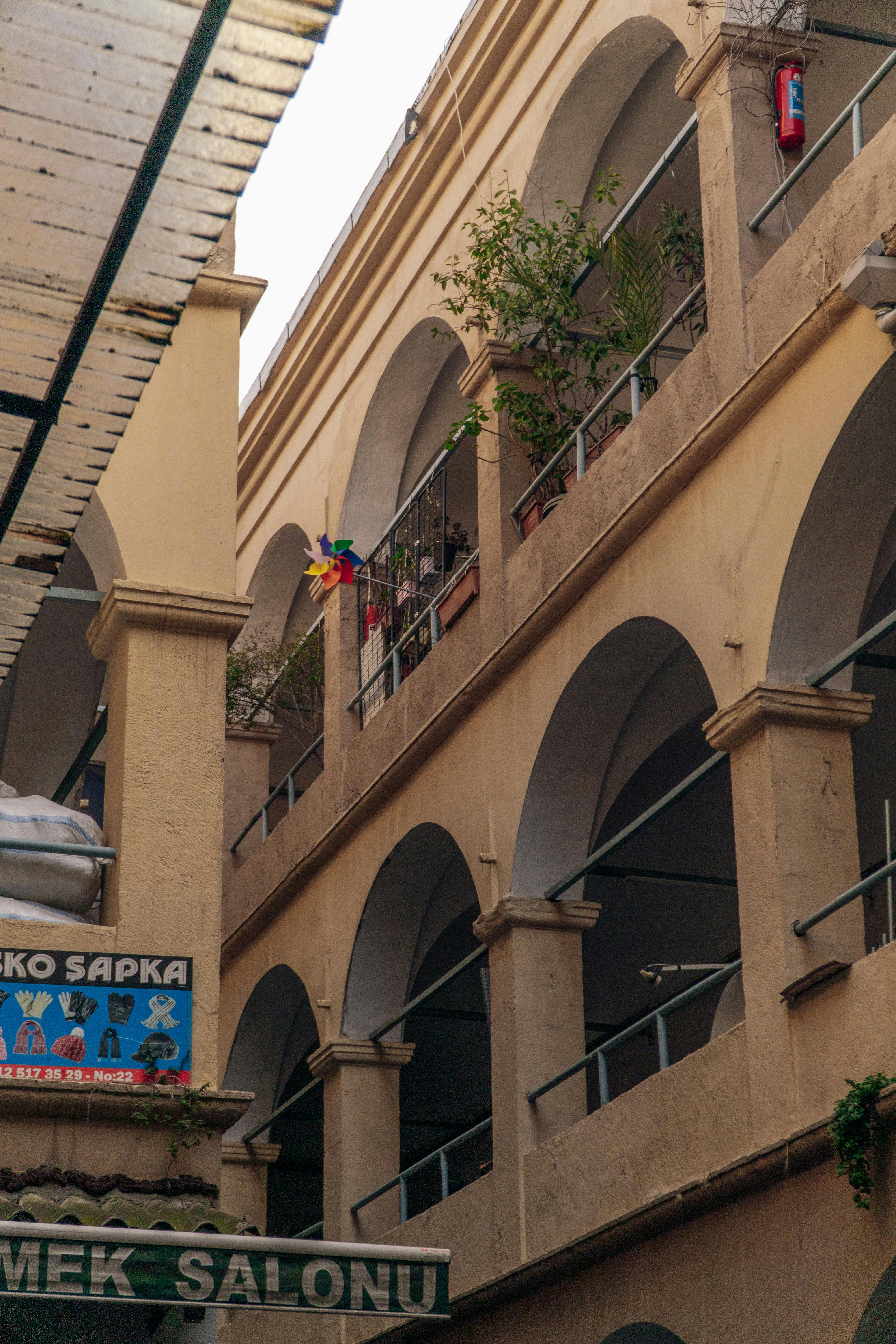 Exterior of a Building with Arch Entrance · Free Stock Photo