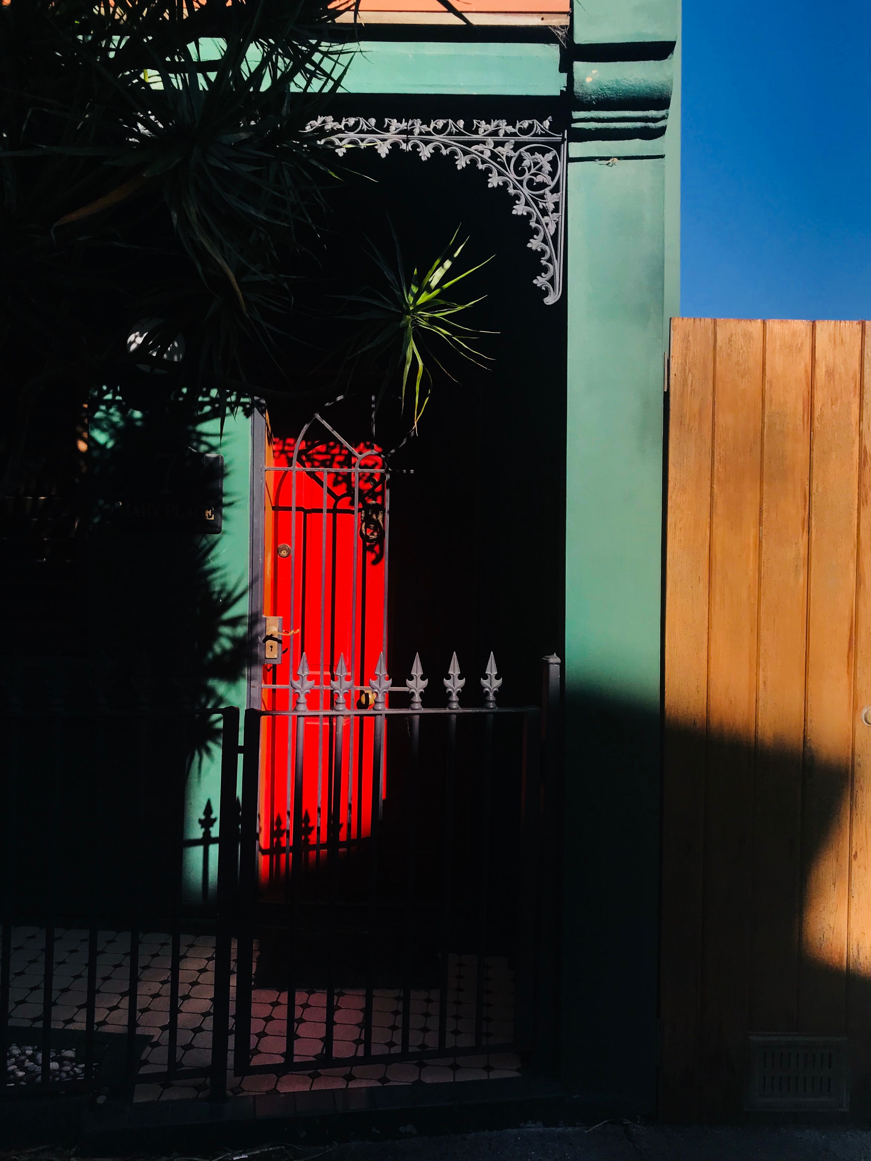 Purple Gate on Orange Wall · Free Stock Photo