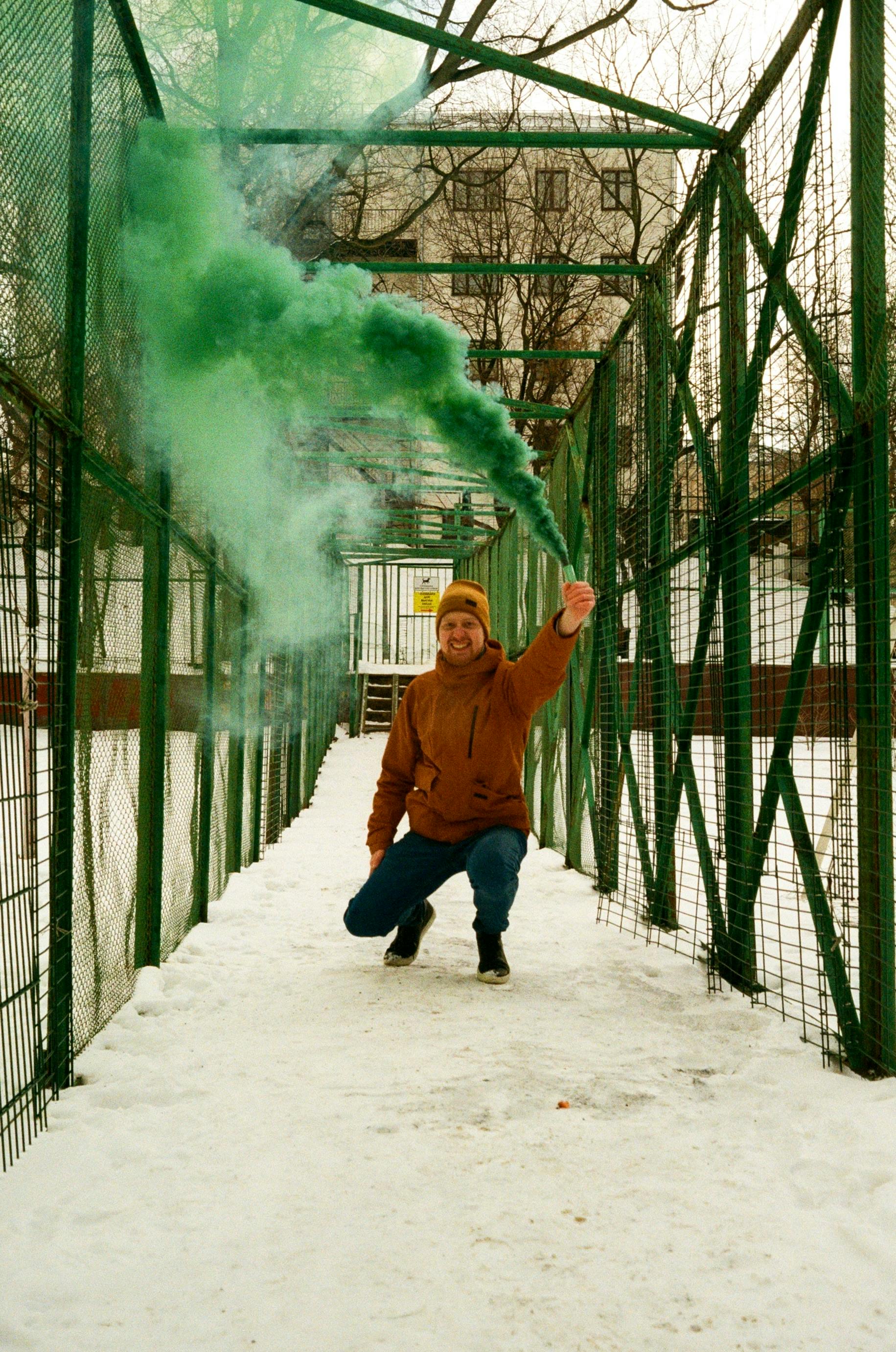 Wooden Torch Near the Metal Fence · Free Stock Photo