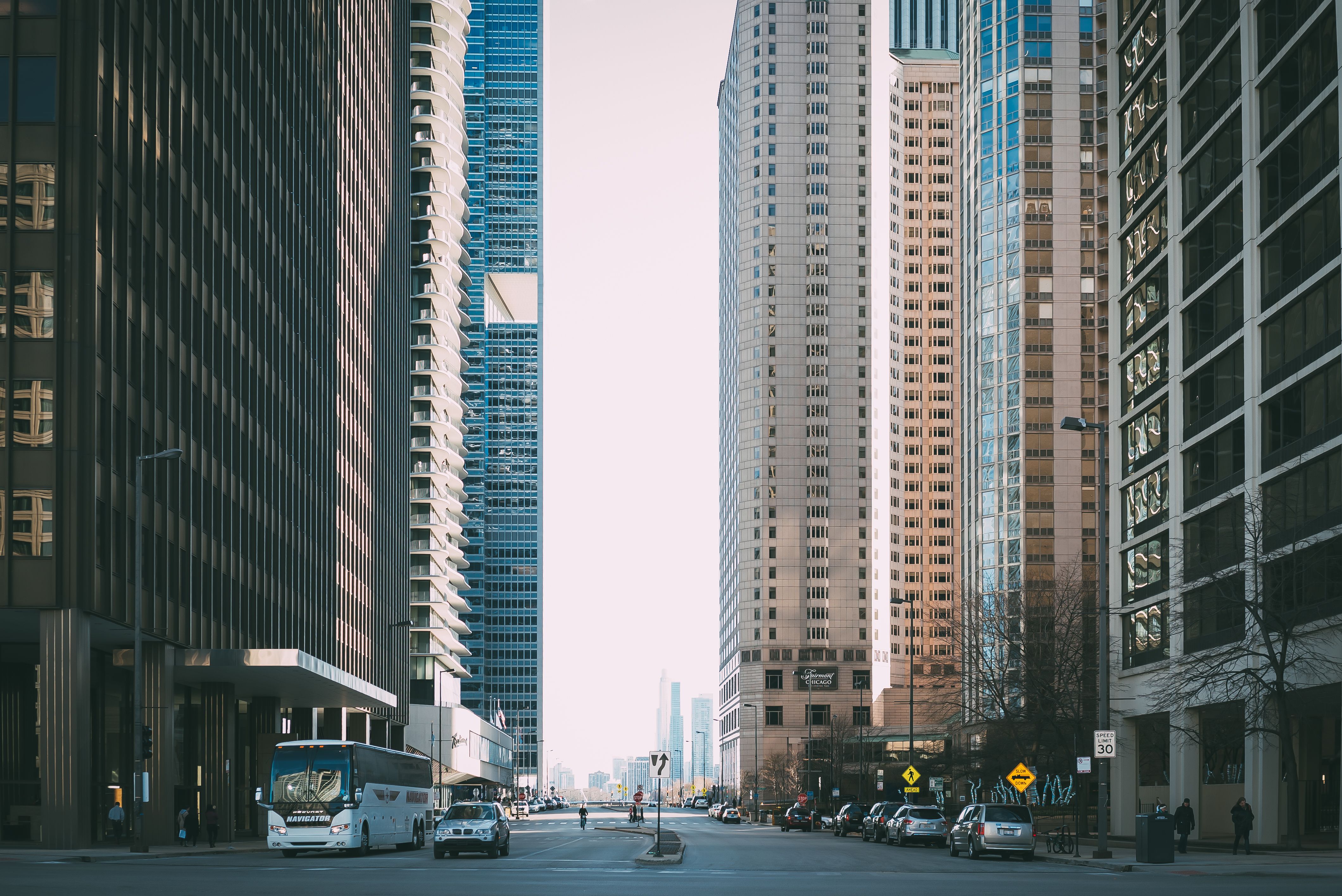 People Walking On Sidewalks Beside Buildings · Free Stock Photo