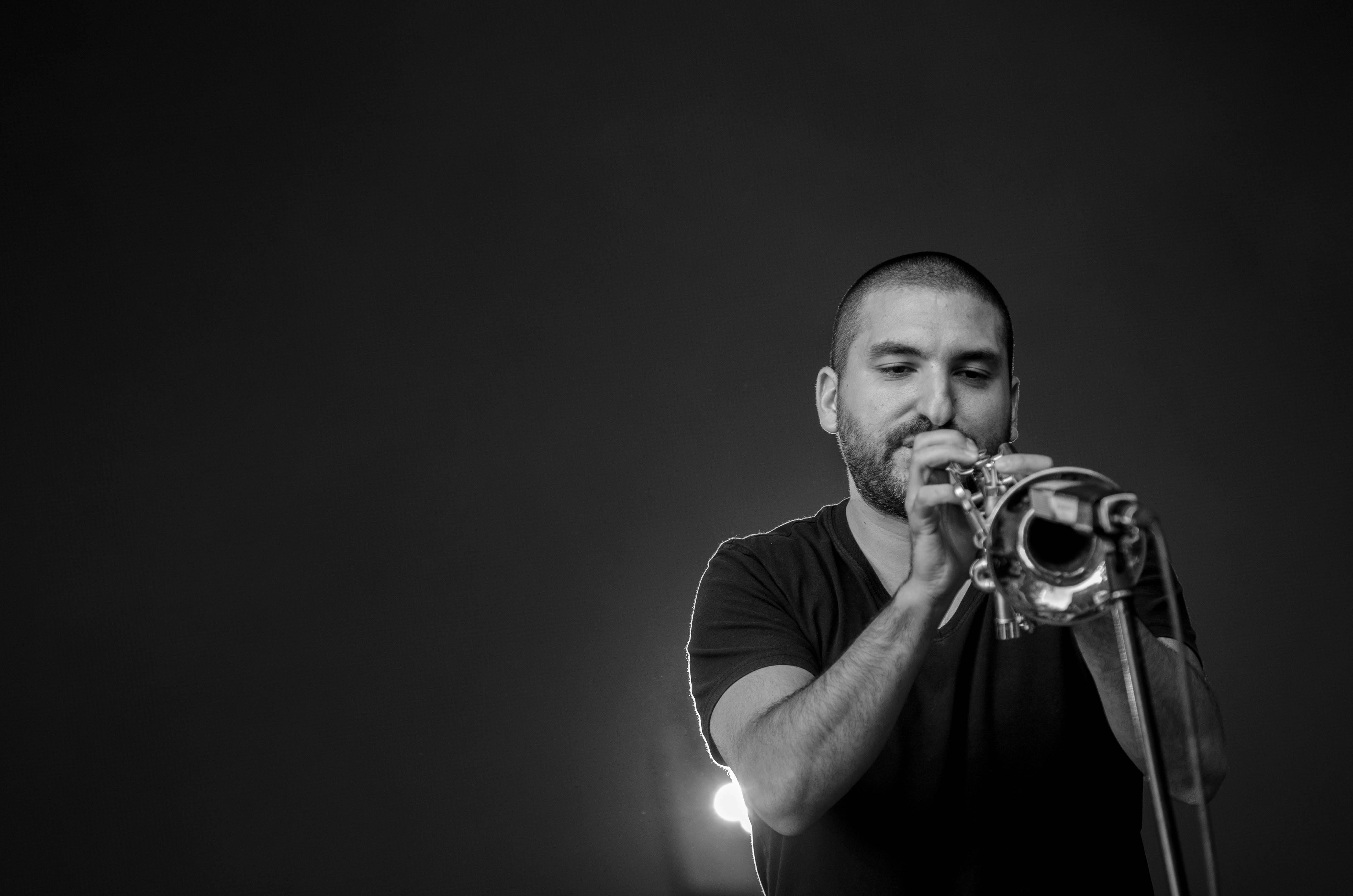 Man Playing Brass Instrument during Daytime · Free Stock Photo
