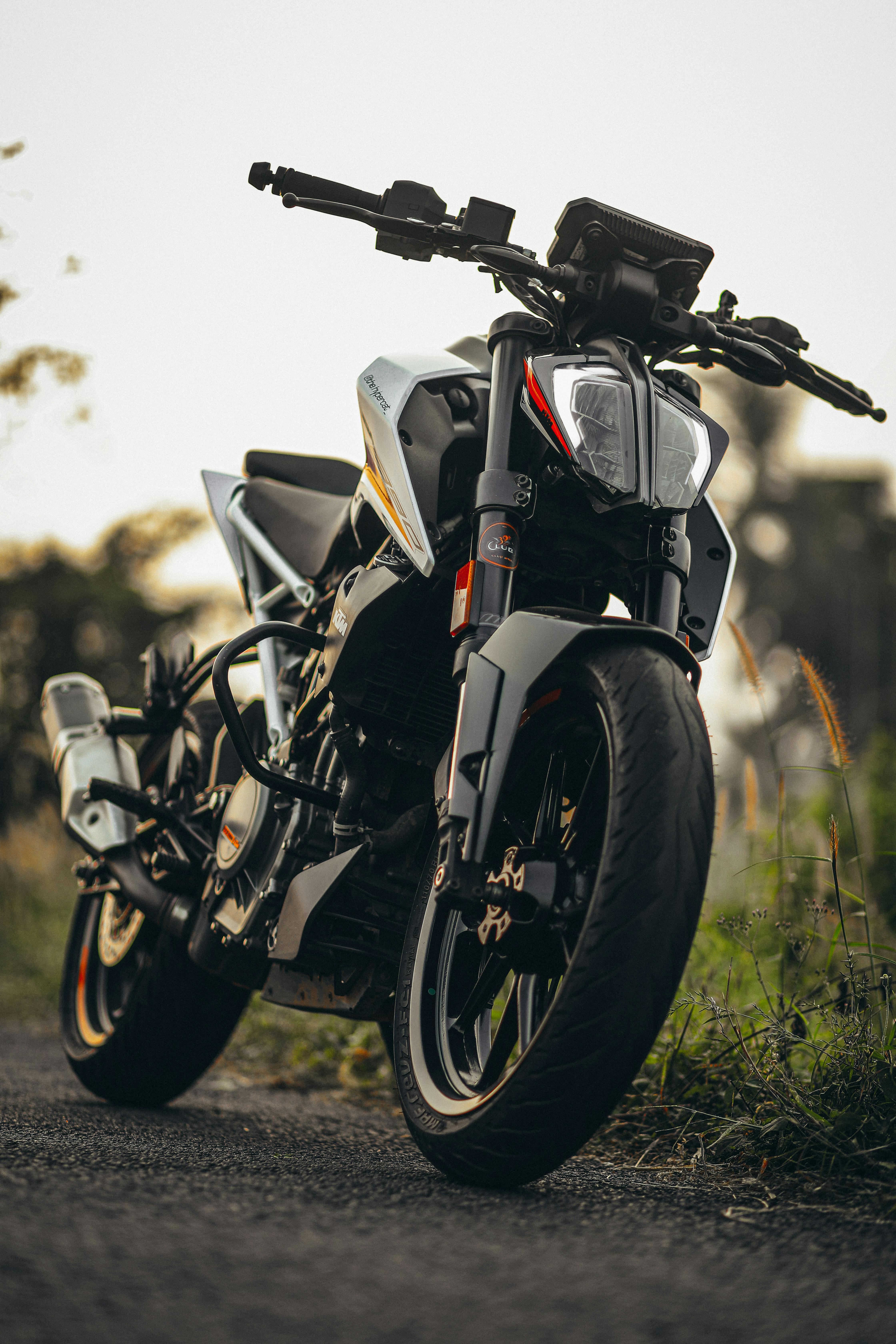 Photo Of Motorcycle Parked On Road · Free Stock Photo