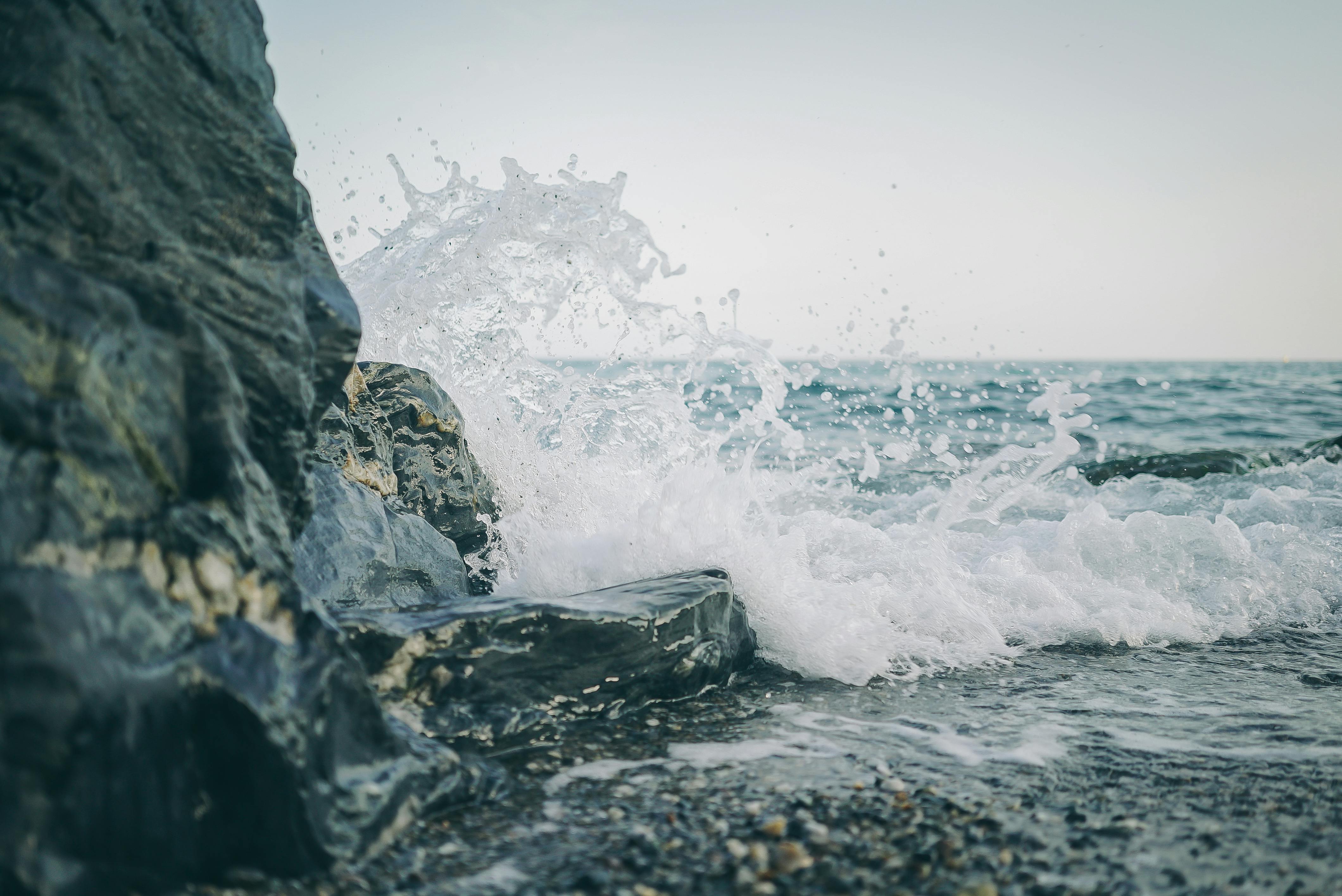 Brown Rock Island on Sea Water Under Blue Sky during Daytime · Free ...