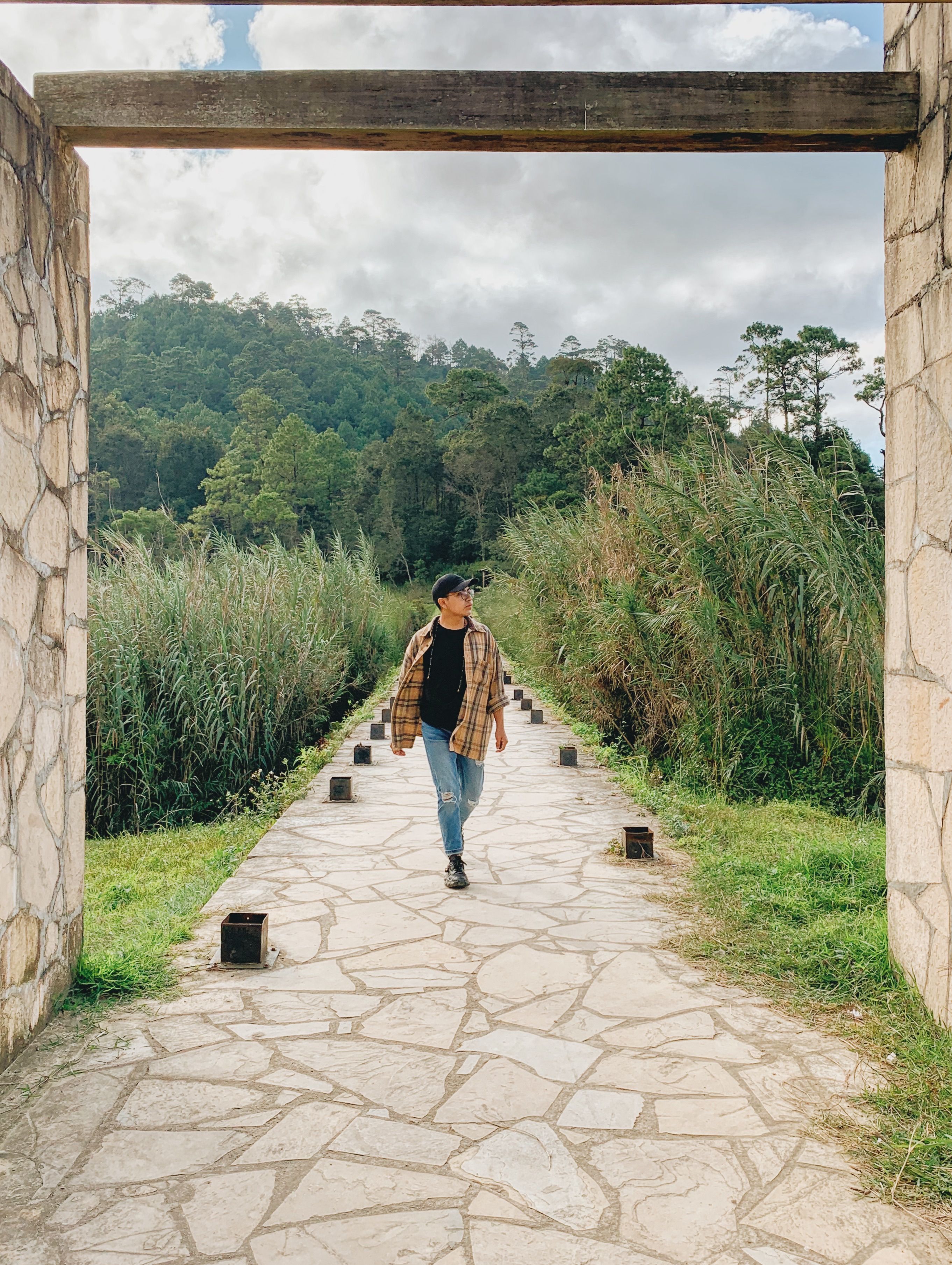Man Wearing Djellaba Walking with a Crutch · Free Stock Photo