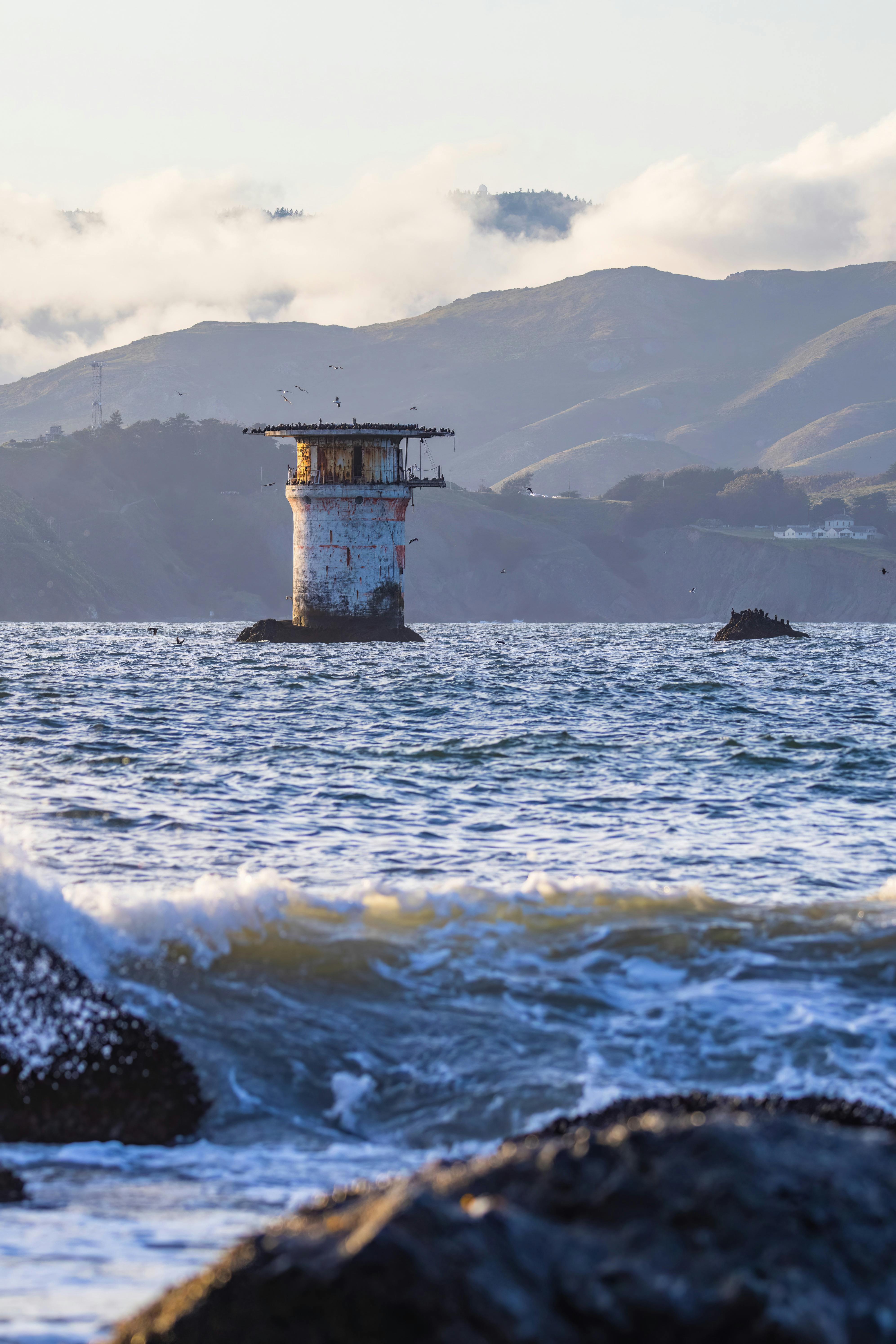Damaged Lighthouse on Water · Free Stock Photo