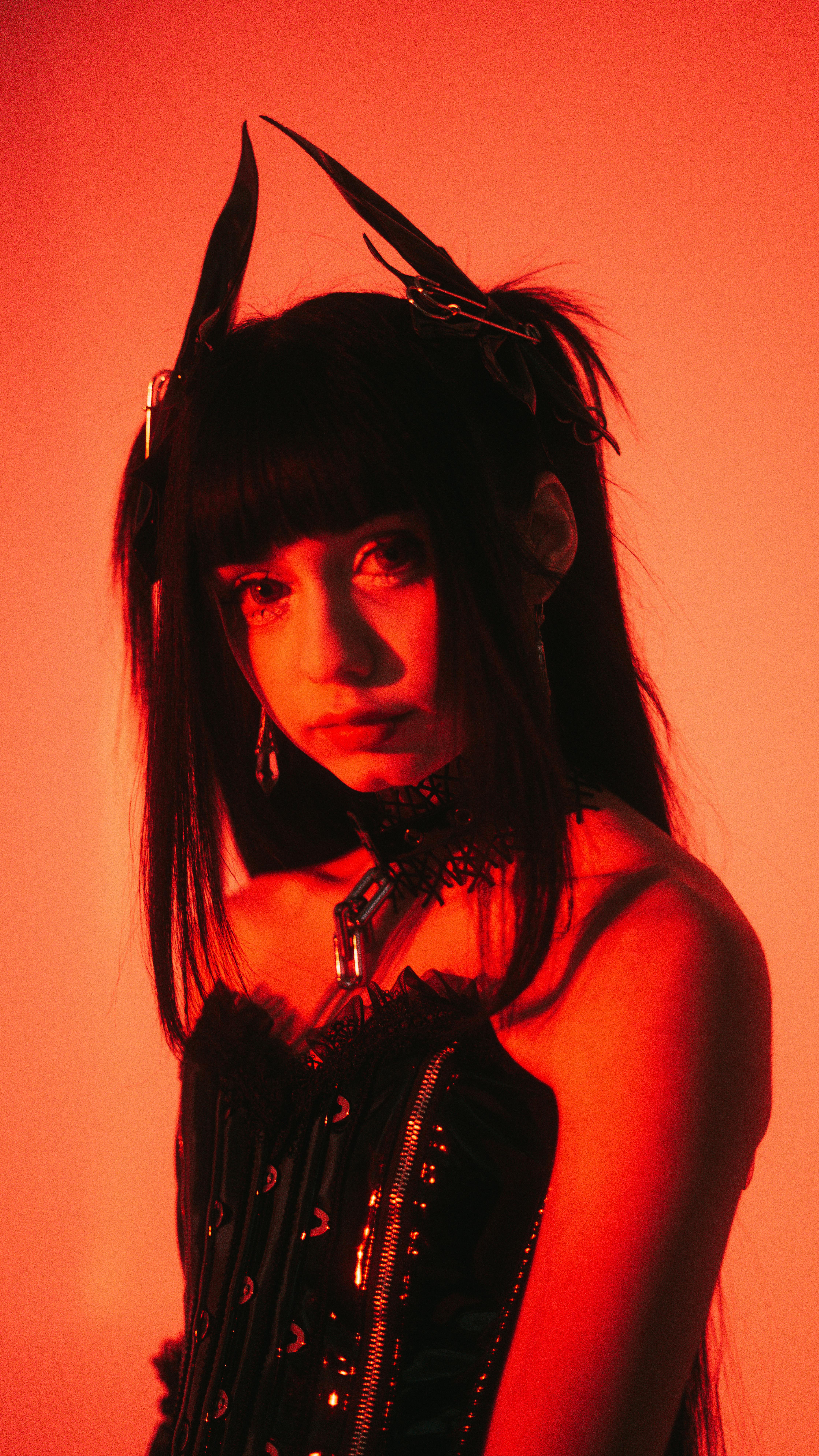 Portrait of a She-devil in a Black Bodysuit · Free Stock Photo