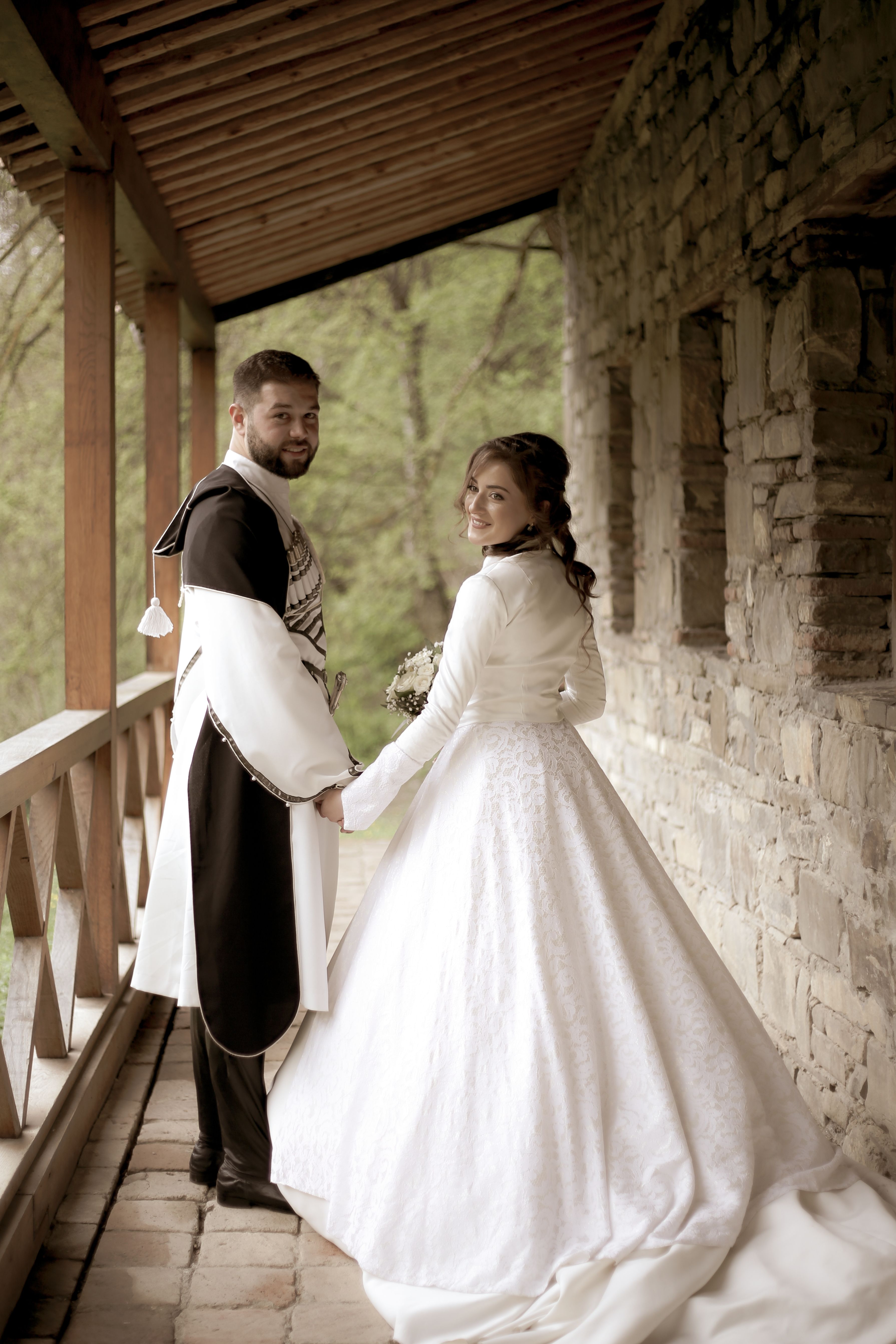 Newlyweds Posing in Traditional Clothing · Free Stock Photo