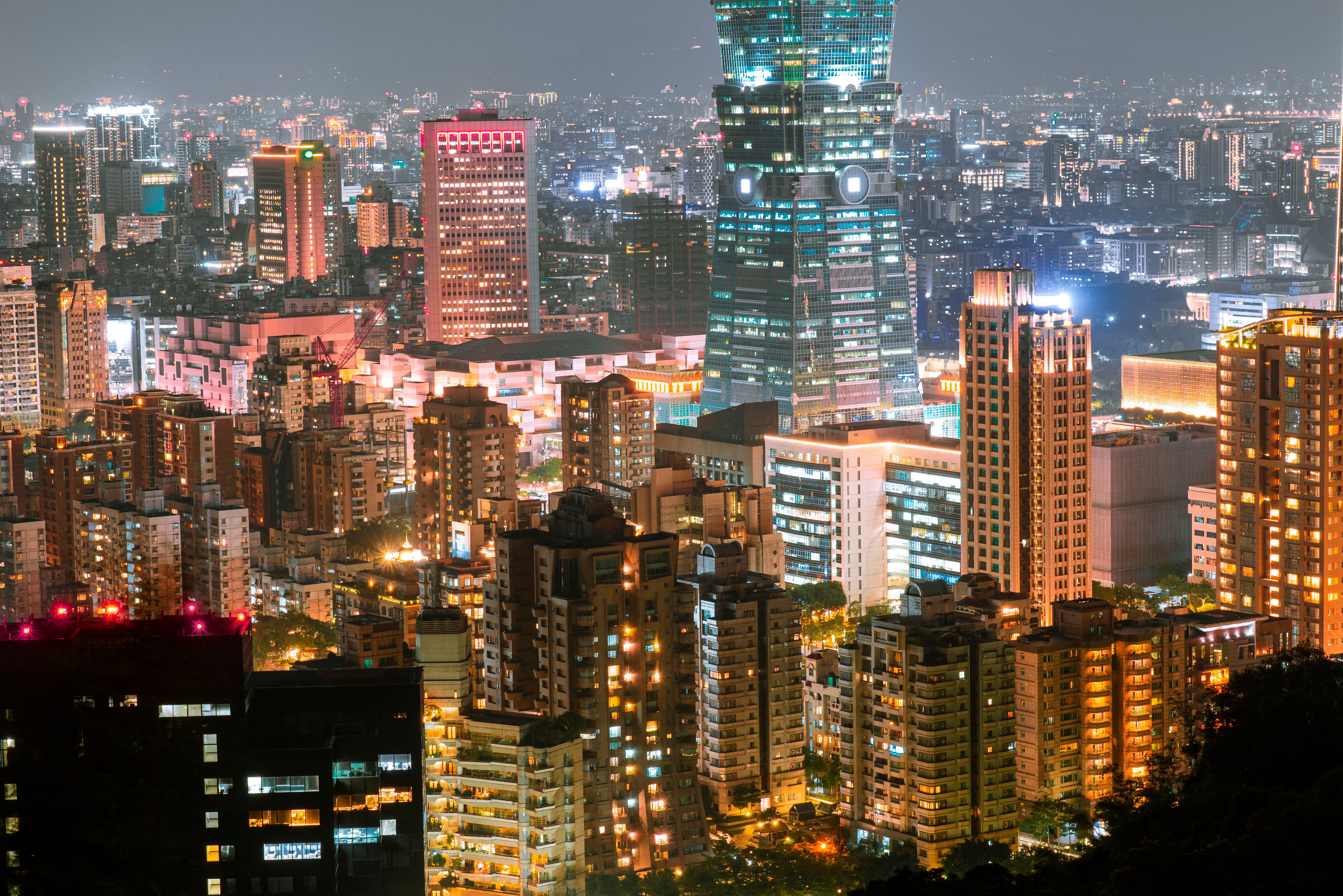 Illuminated Buildings in City at Night · Free Stock Photo