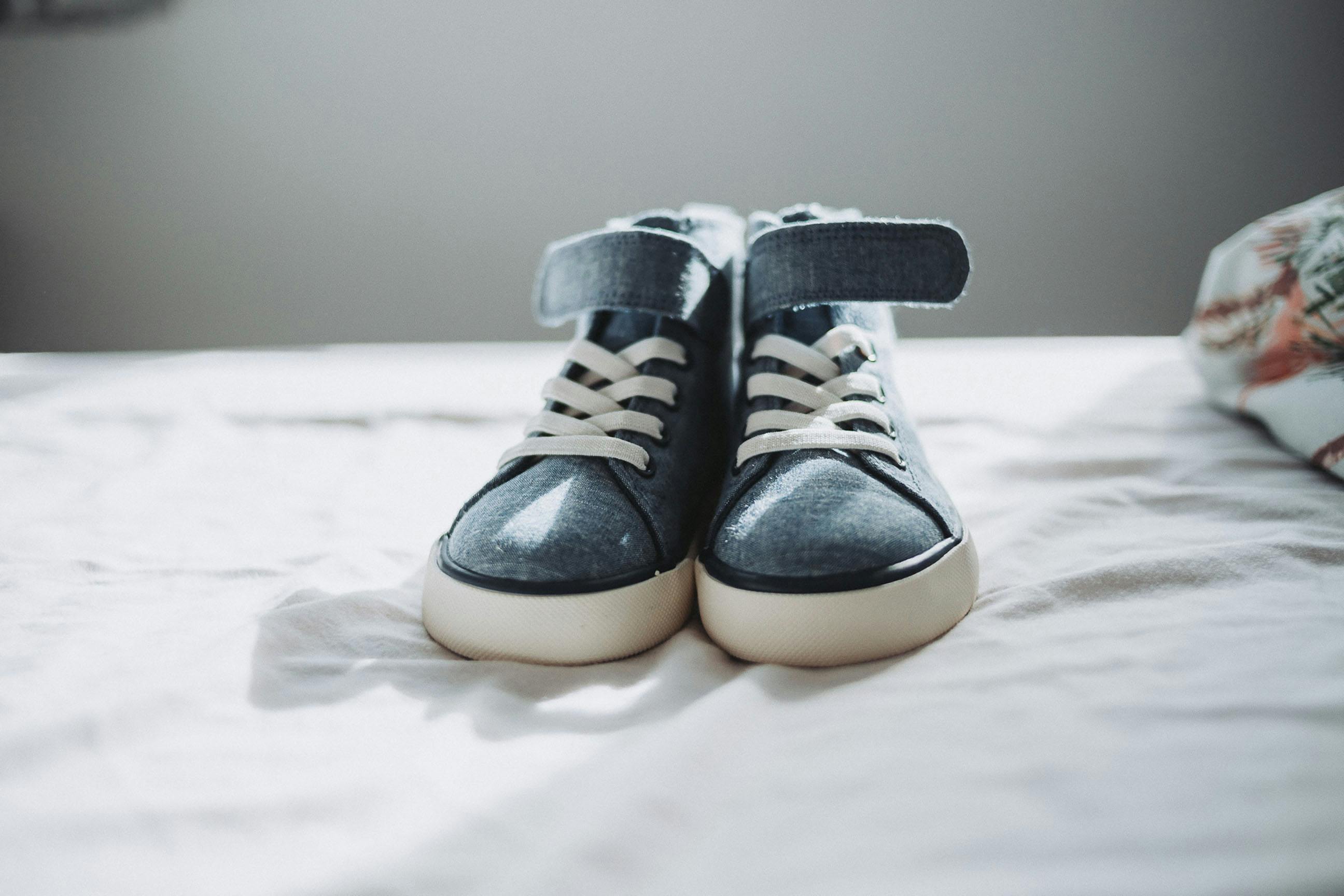 Shoes on Bed · Free Stock Photo