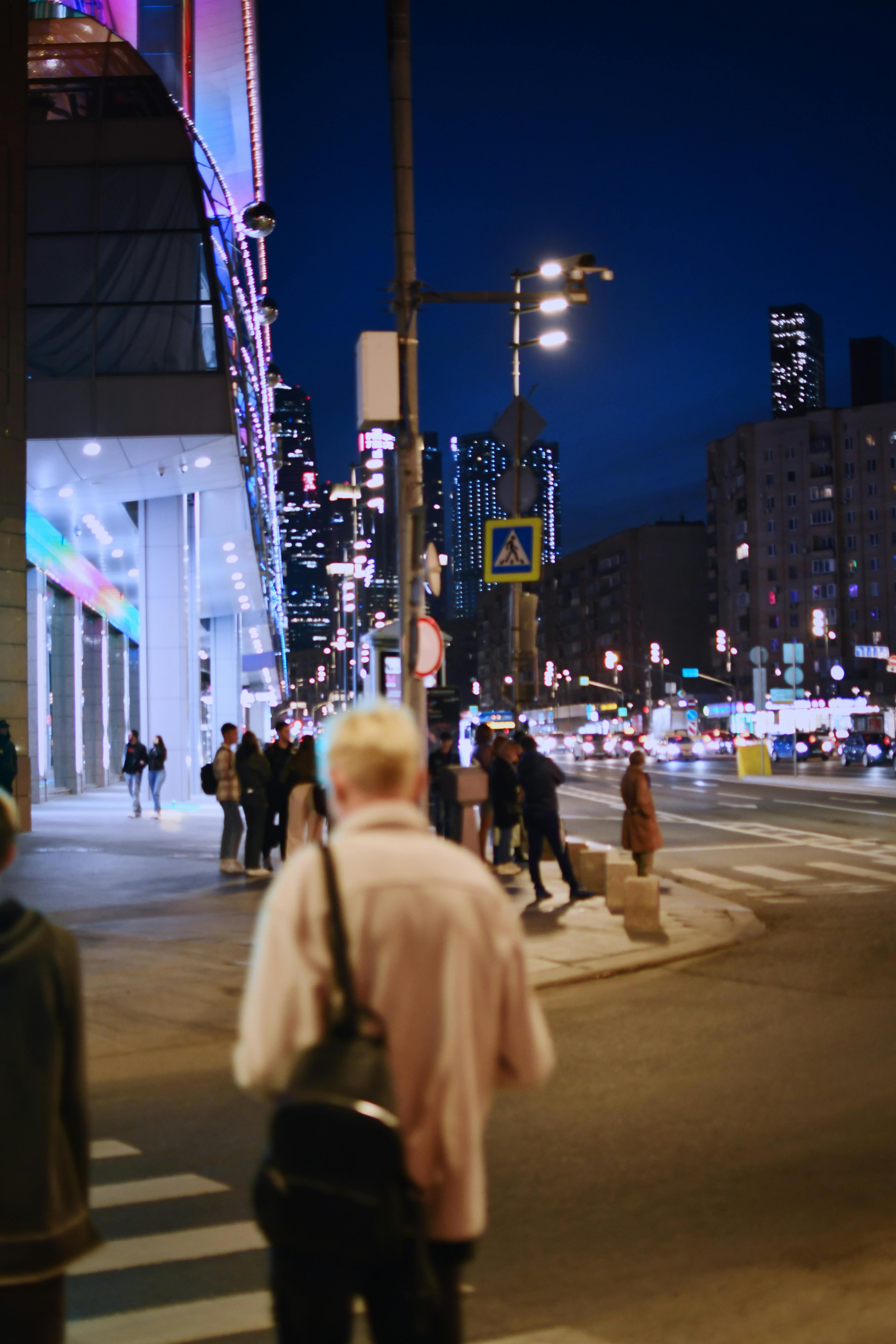 People Walking in Alley with Stores in City at Night · Free Stock Photo