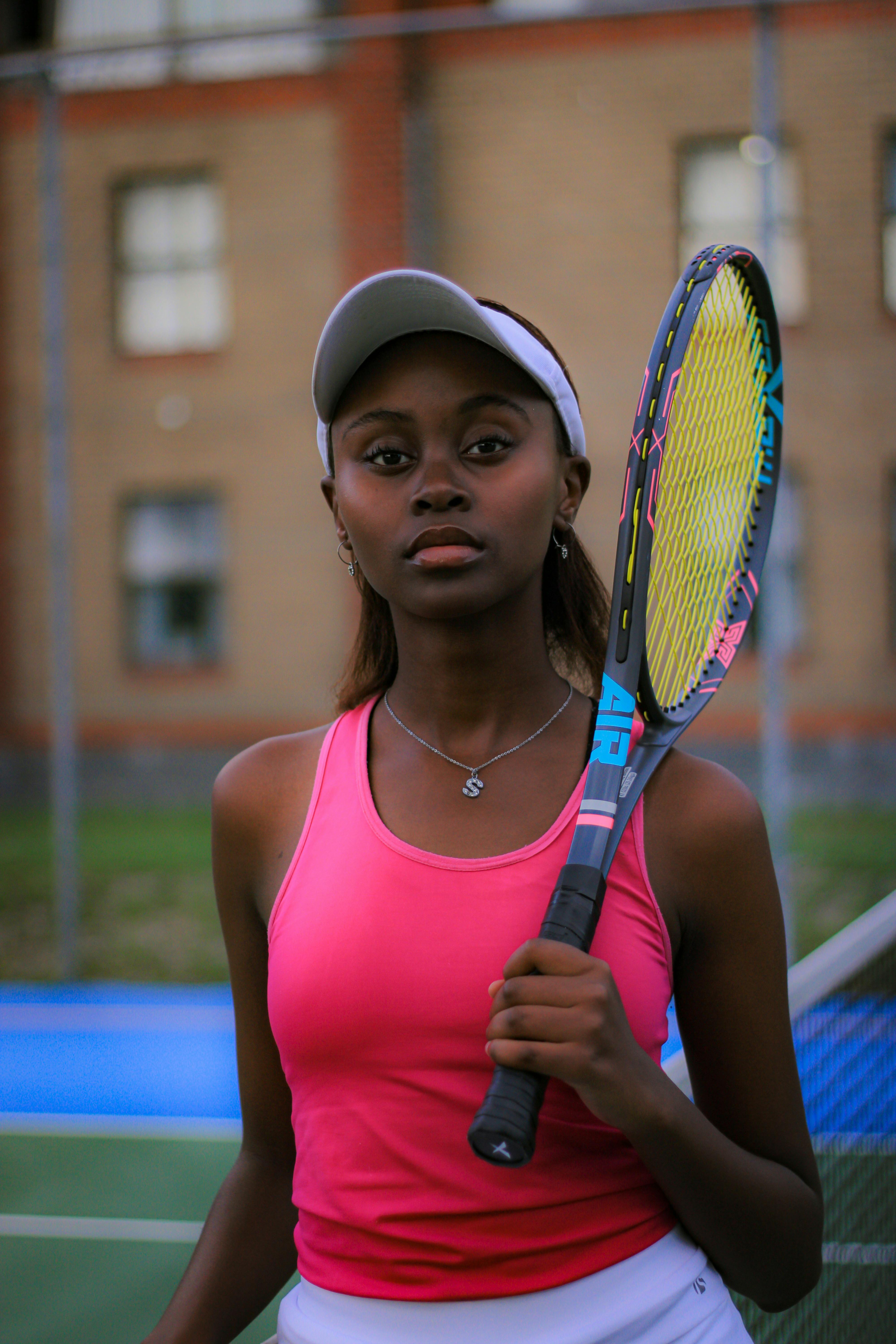 Woman Posing with Tennis Racket · Free Stock Photo