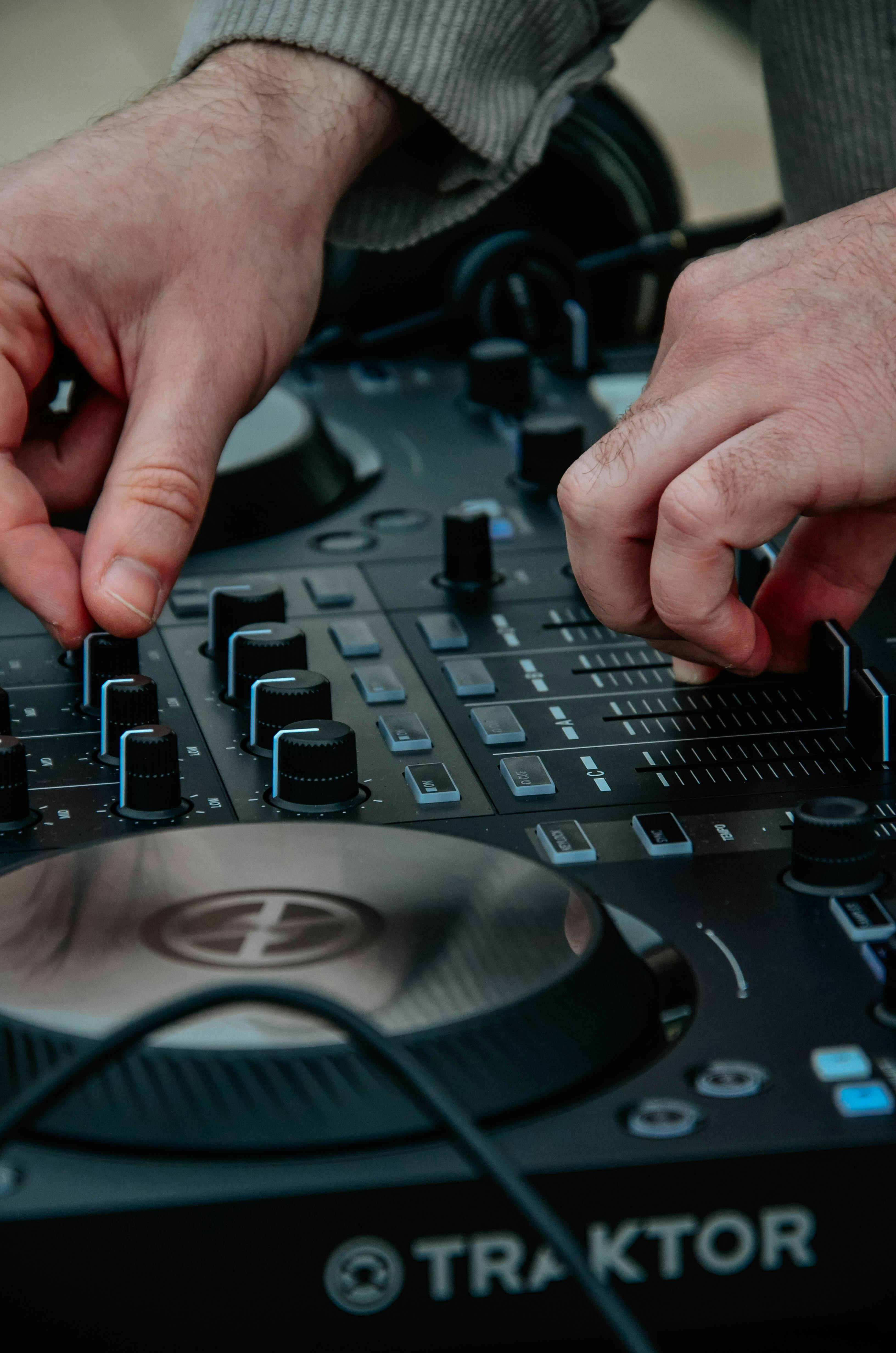 Man Hands on DJ Mixer · Free Stock Photo