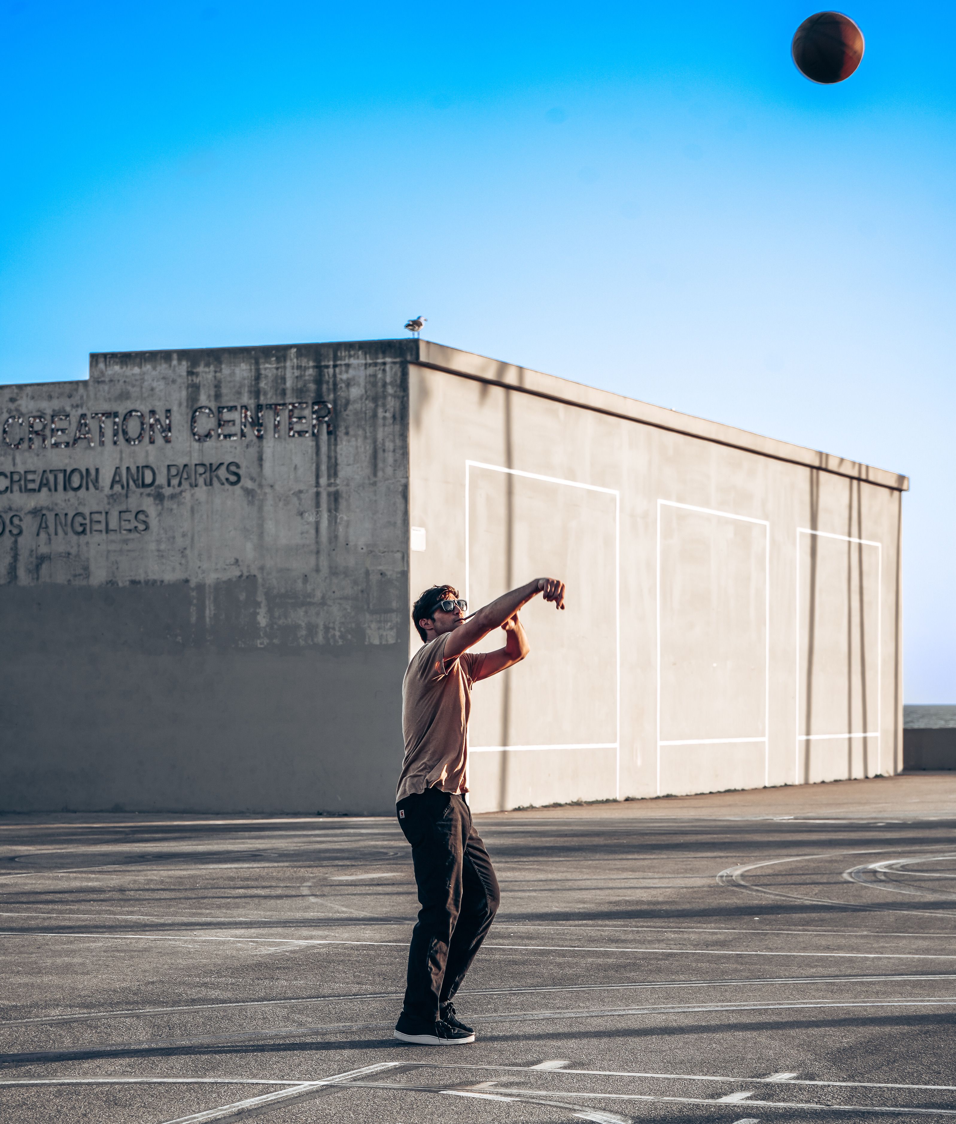 Man Shooting Basketball Into the Basketball Hoop · Free Stock Photo