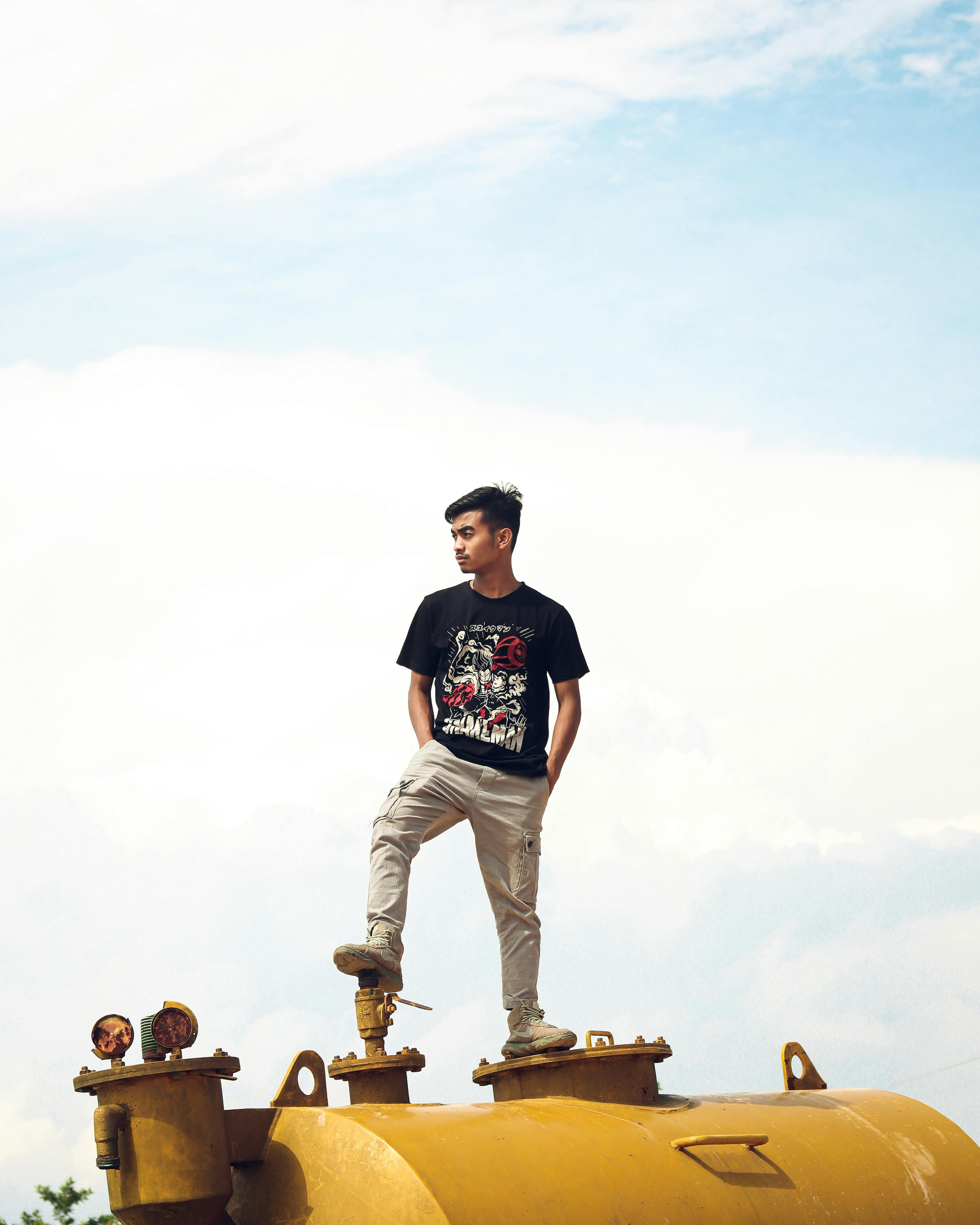 Man Standing and Posing in Black T-shirt · Free Stock Photo