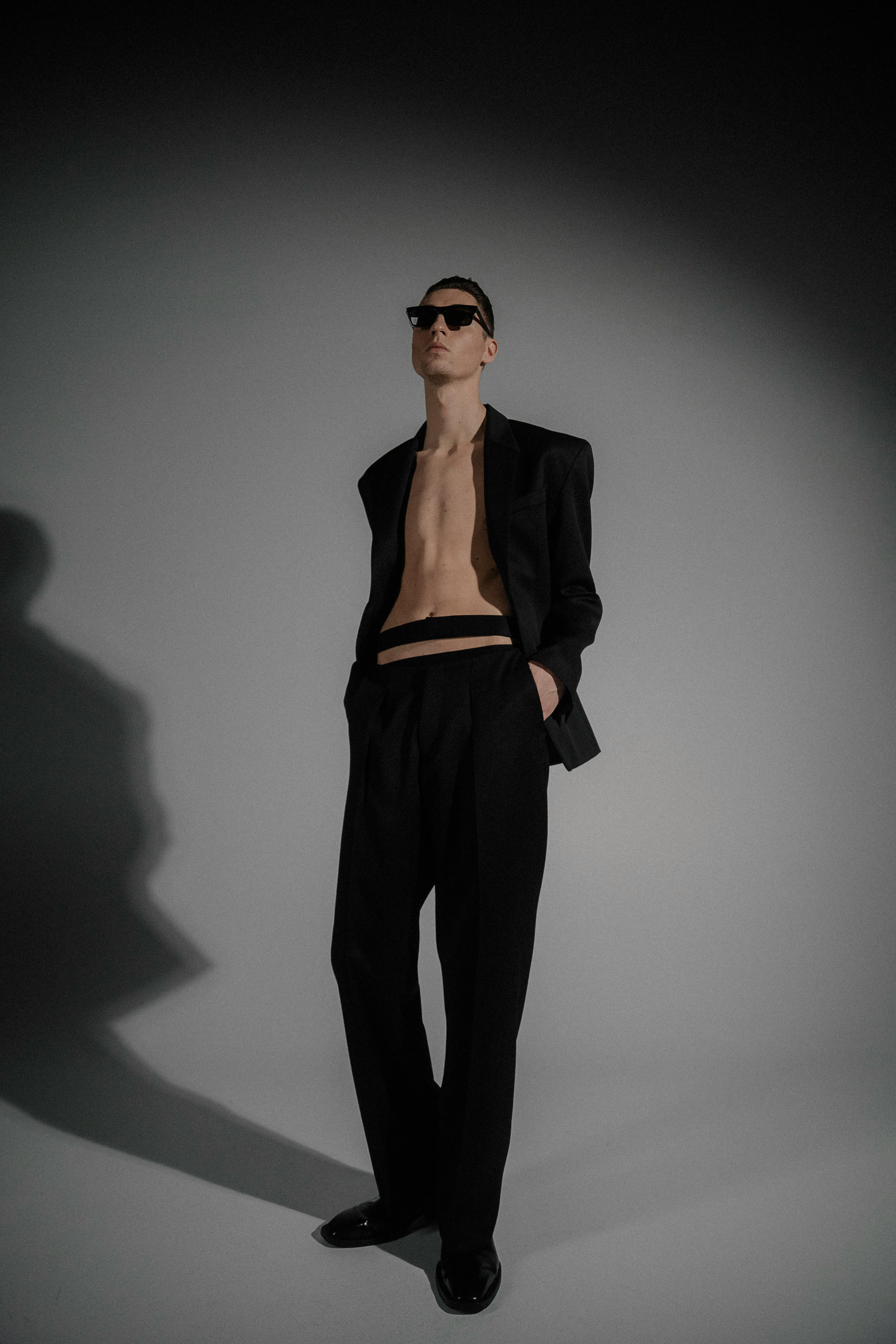 Men in Suits and Crowns Posing with Woman · Free Stock Photo