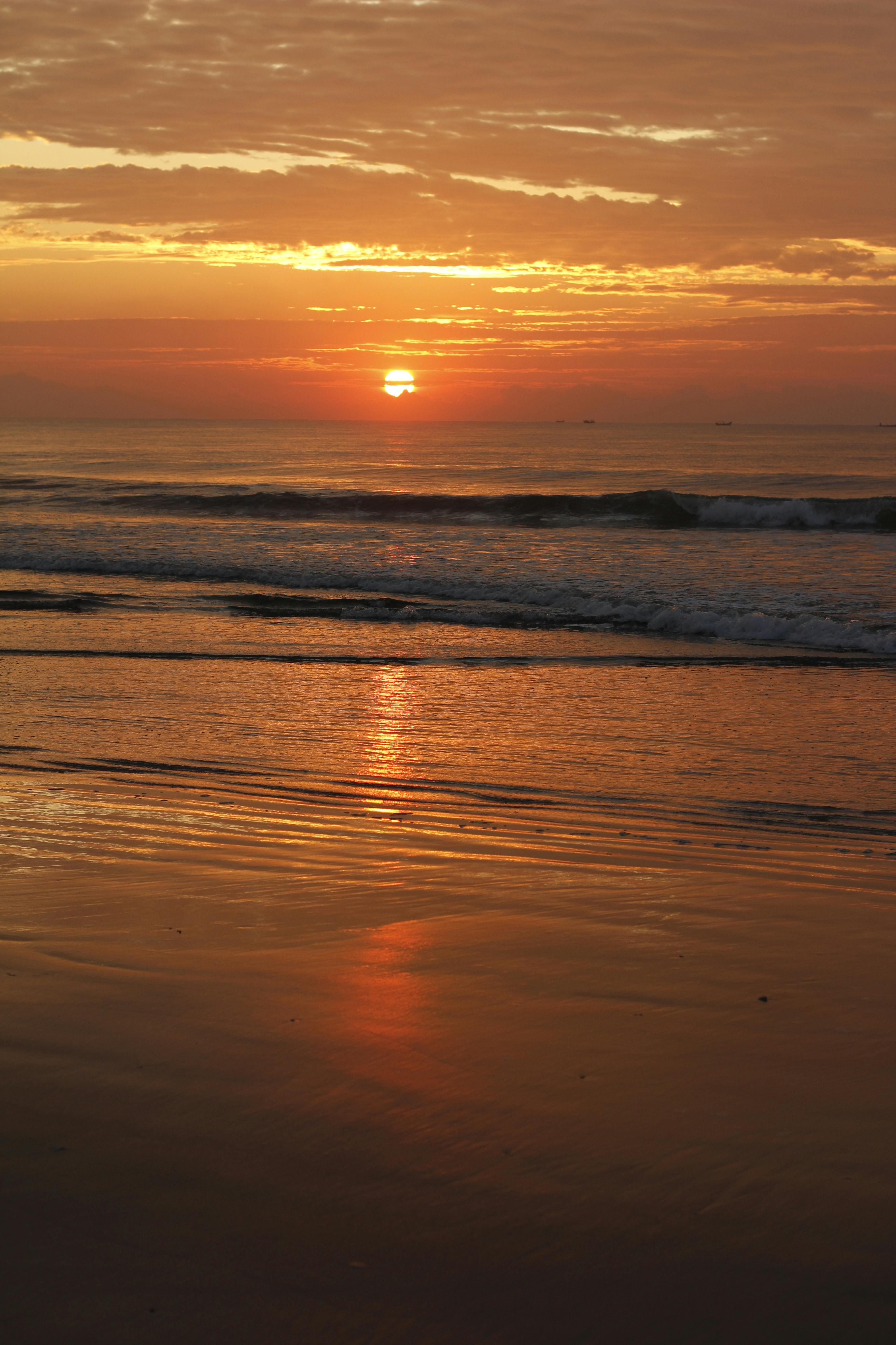 Silhouette Photo of a Man Walking on Seashore During Sunset · Free ...