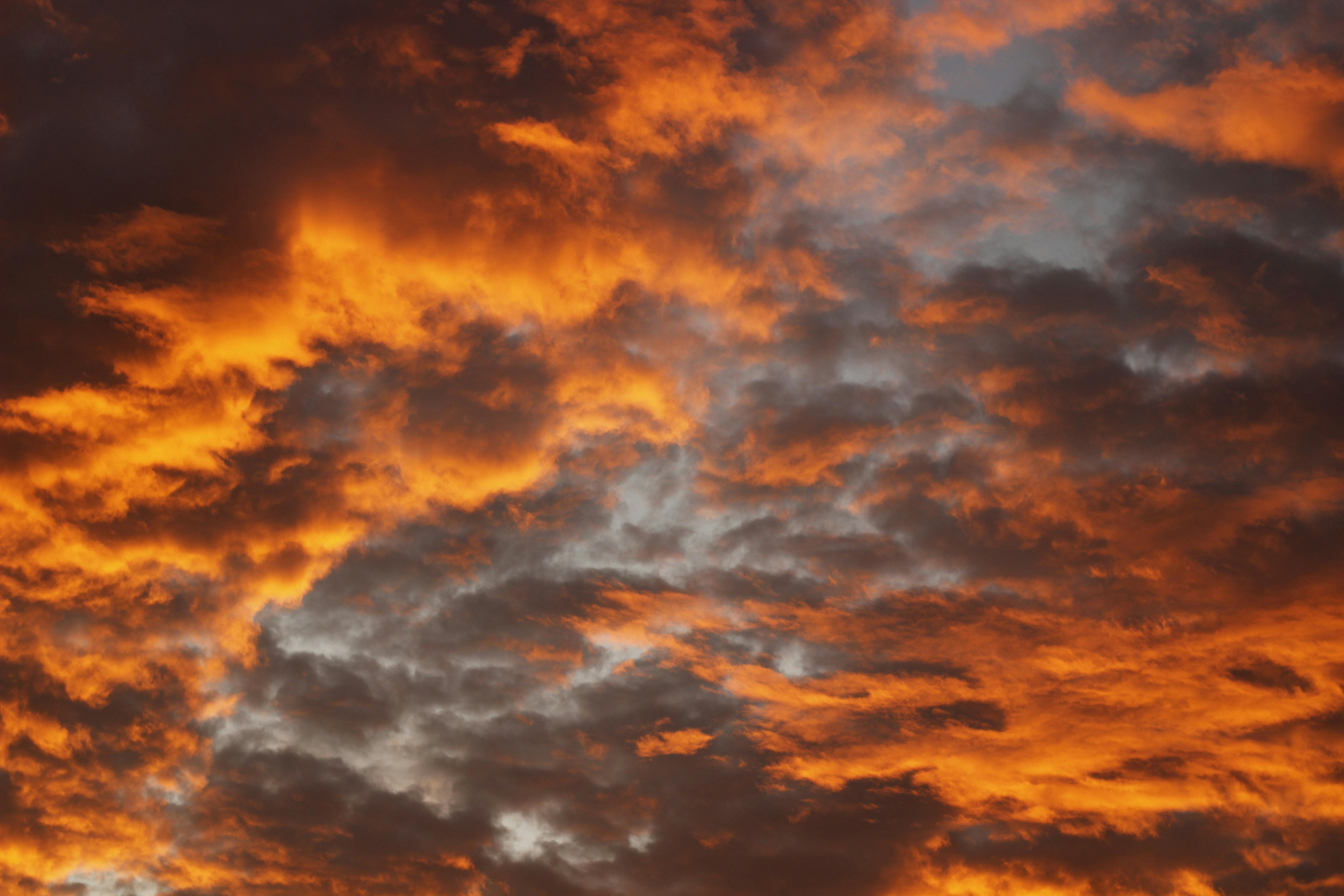 A Dramatic Sunset Sky with Bright Orange Clouds · Free Stock Photo