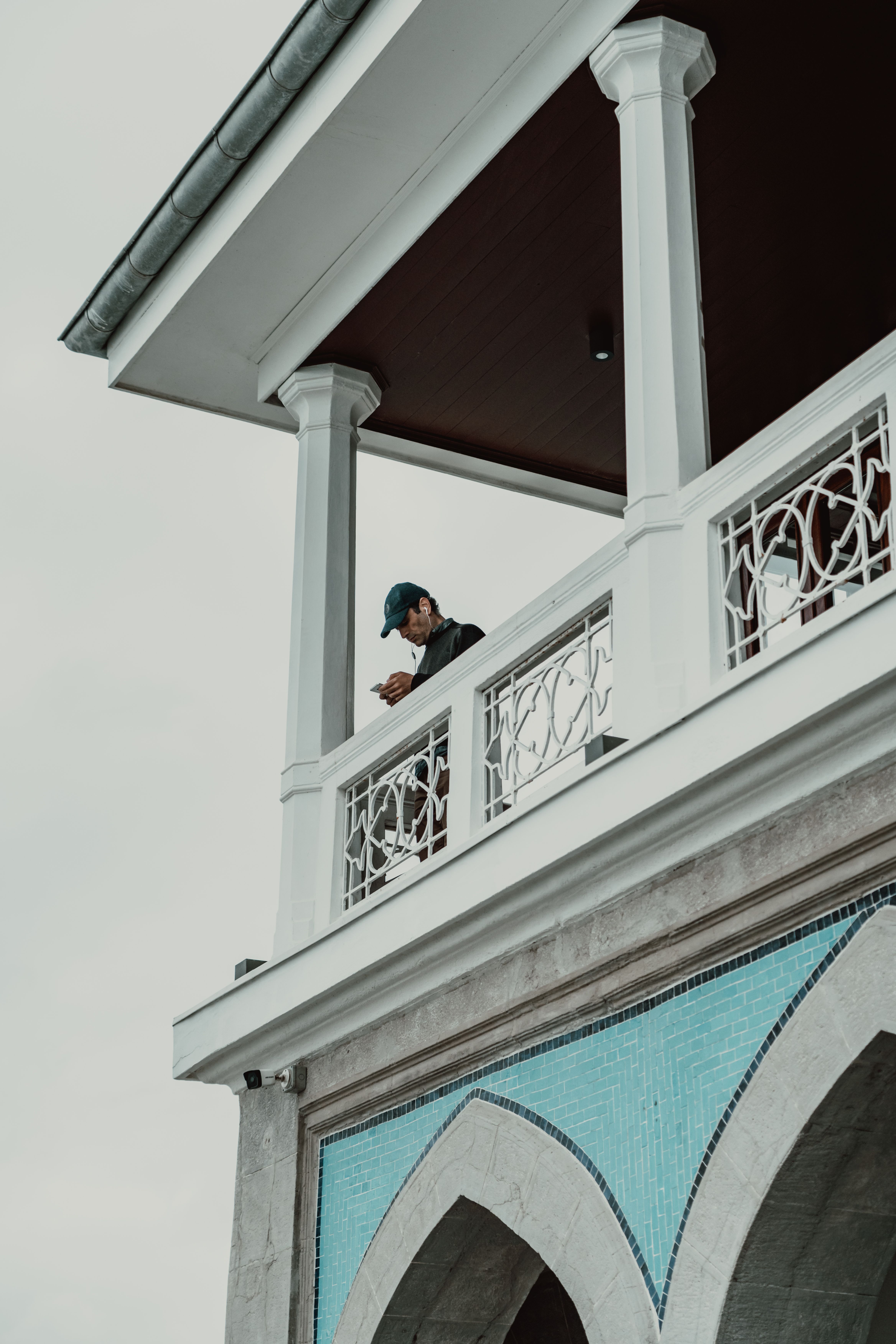 A Man Standing on a Balcony · Free Stock Photo