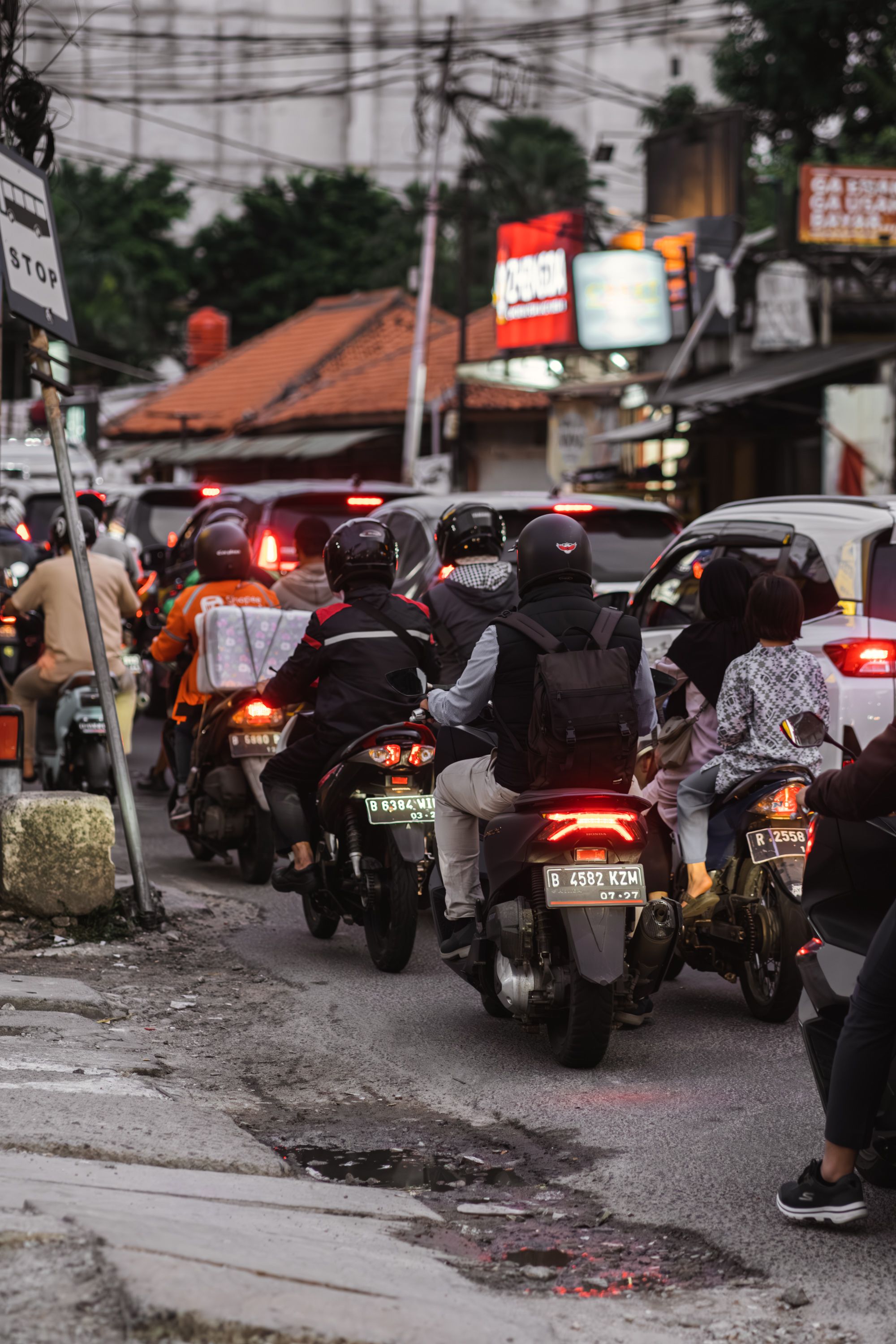 Two Person Riding Motorcycle Beside Vehicles · Free Stock Photo
