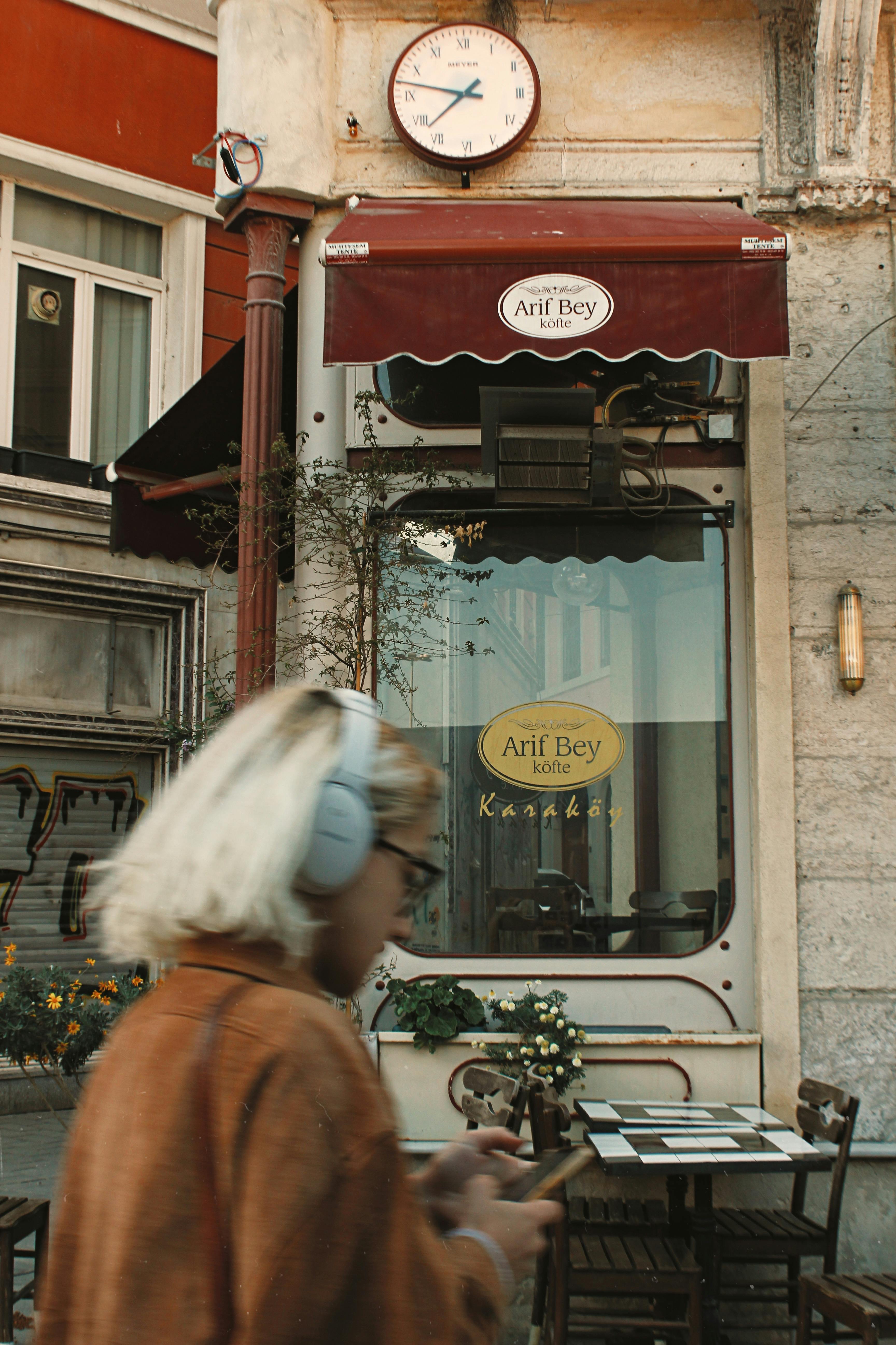 Woman Walking near Food Bar with Kofte in Istanbul · Free Stock Photo