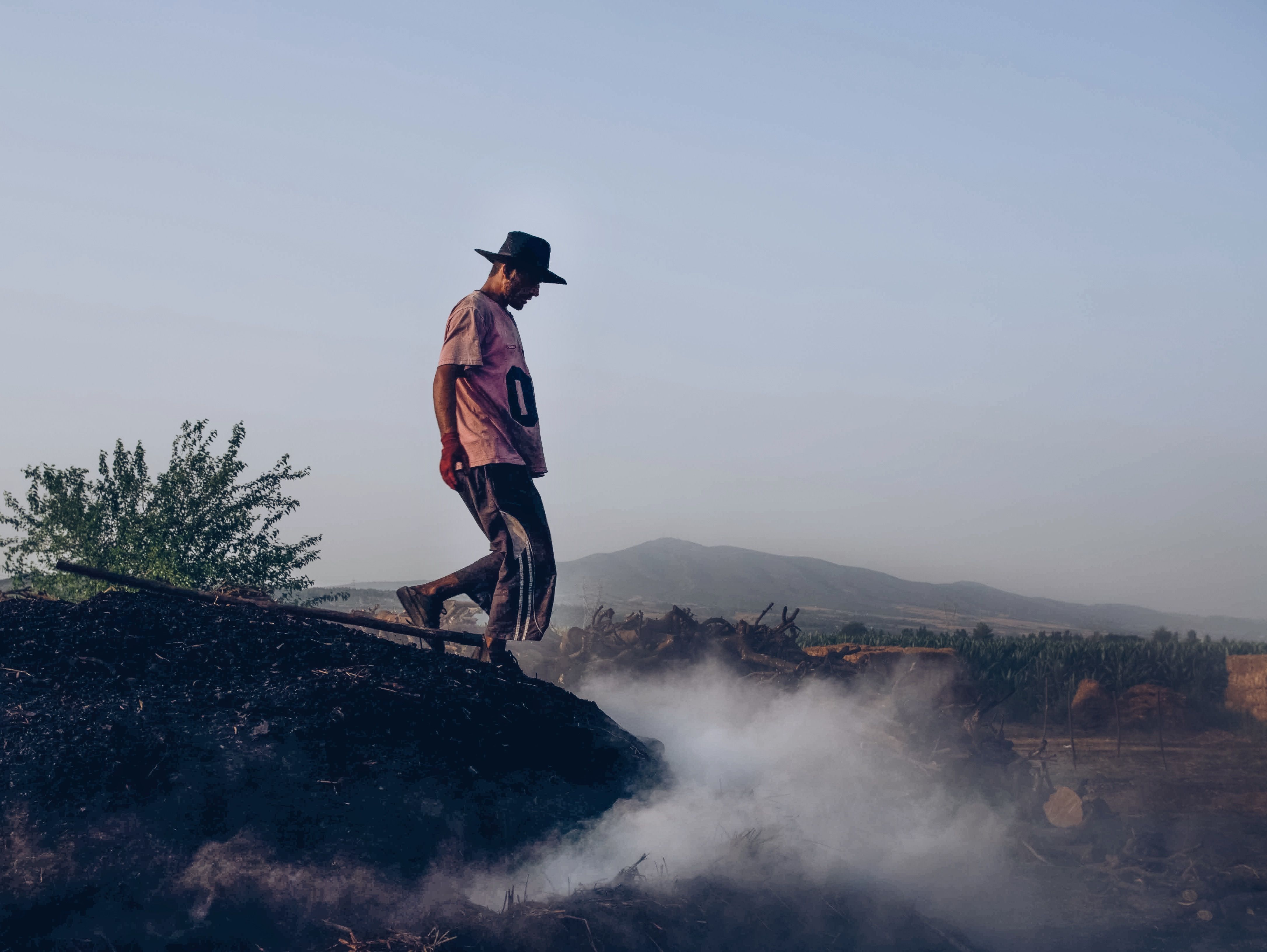 Man Walking on Burnt Ground · Free Stock Photo