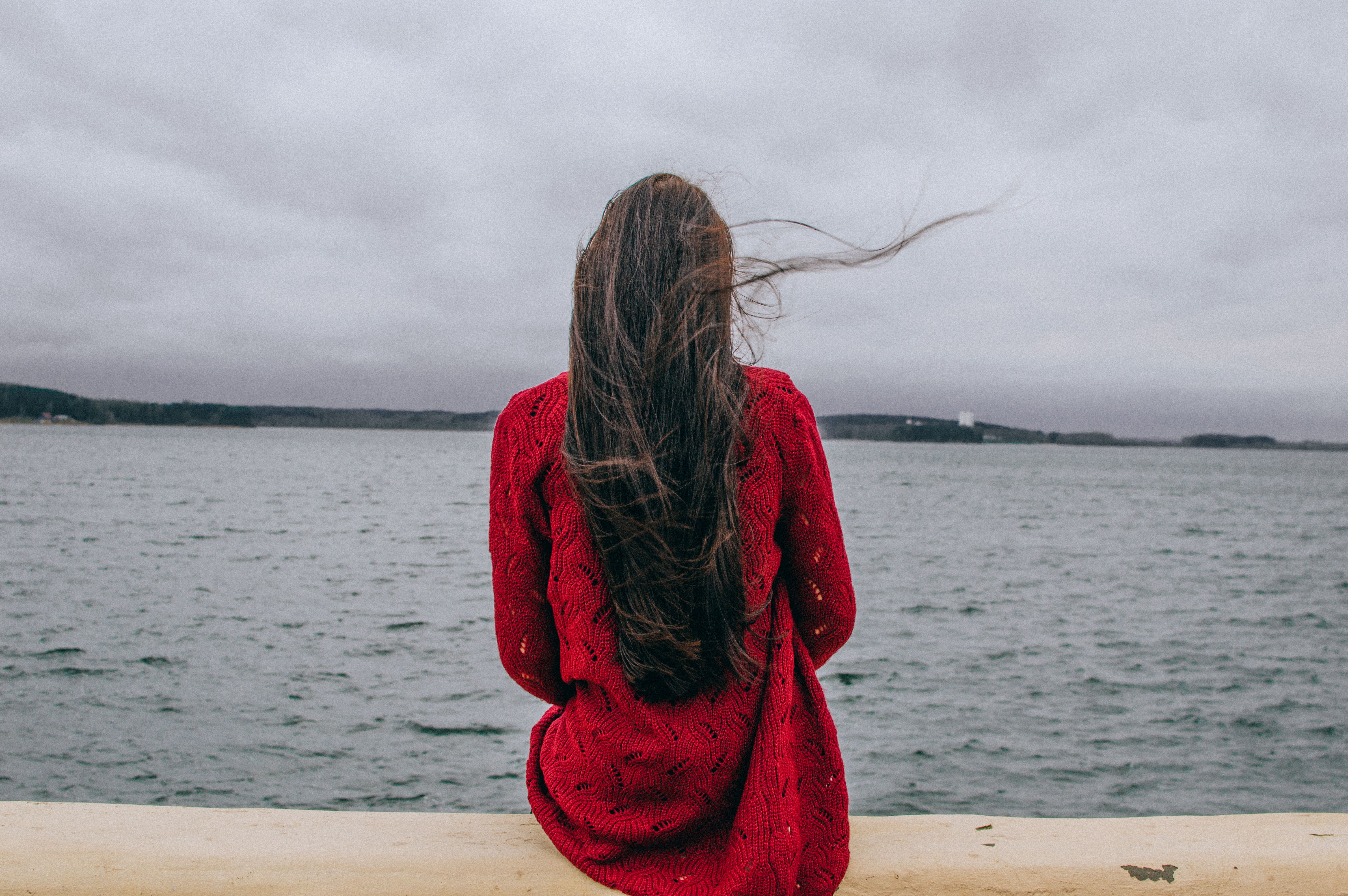 Woman Sitting and Looking at Sea · Free Stock Photo