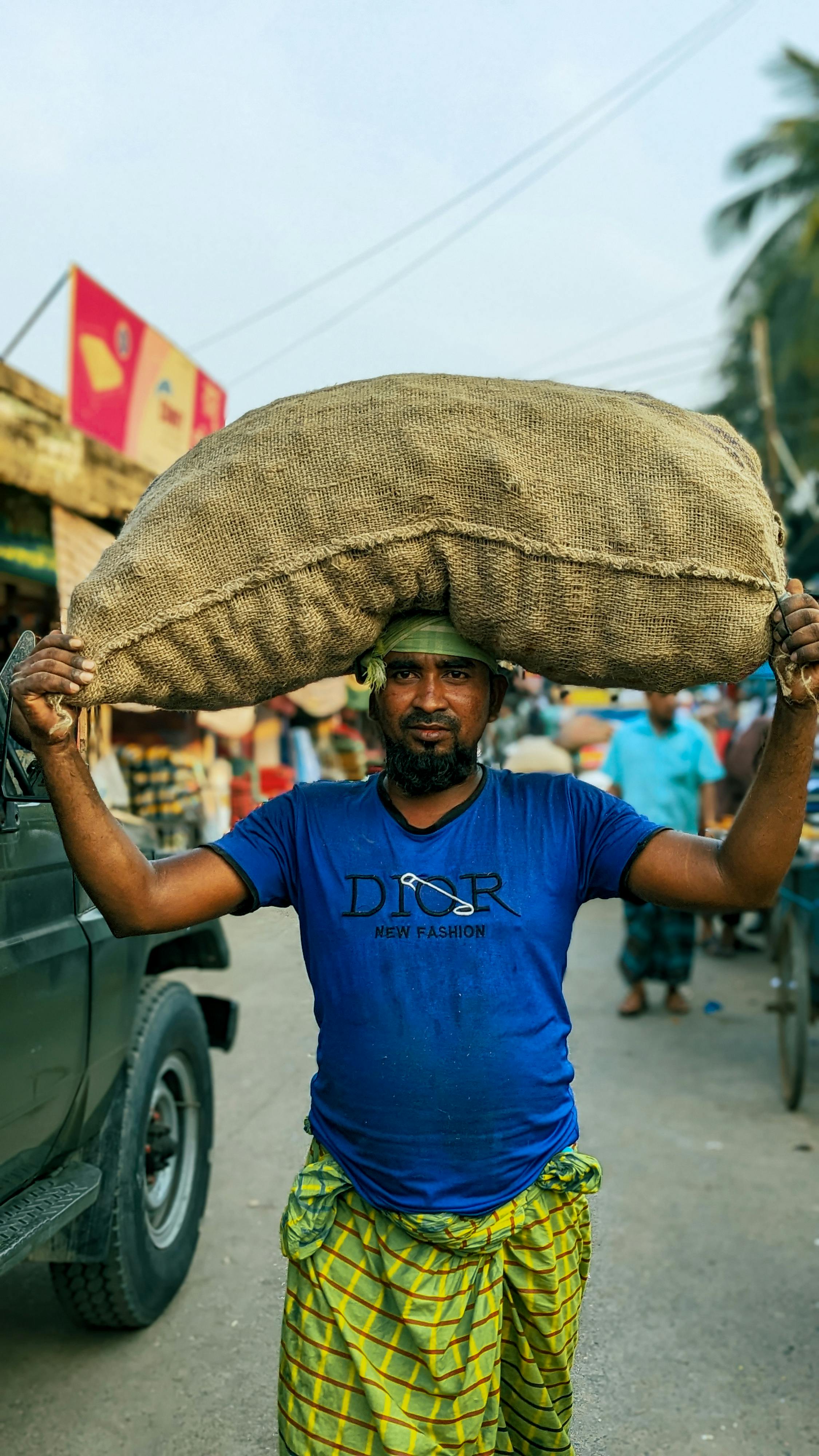 Man Carrying Bag on Street in Village · Free Stock Photo